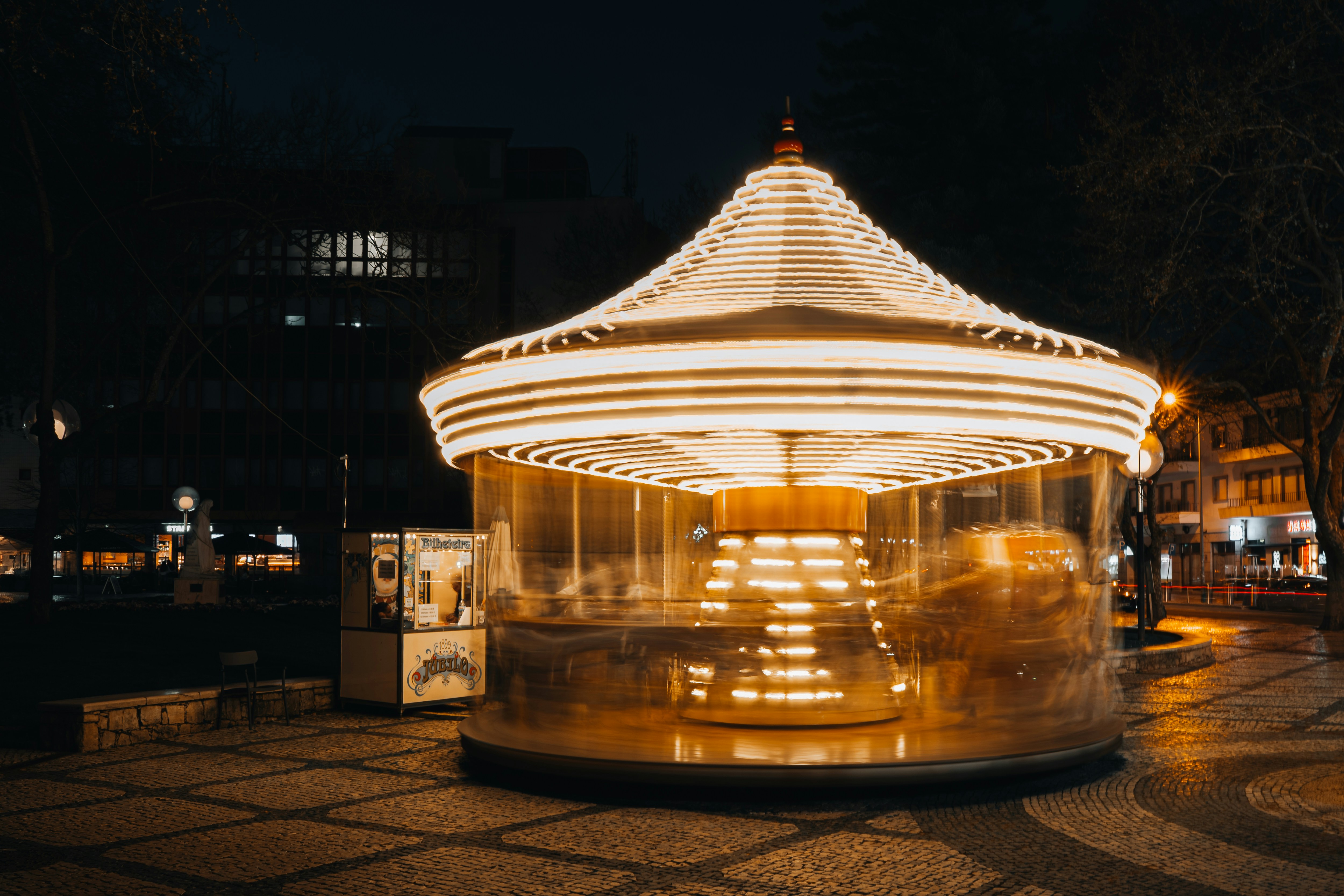 Midnight Carousel: Neon Rings in a Quiet Town Square