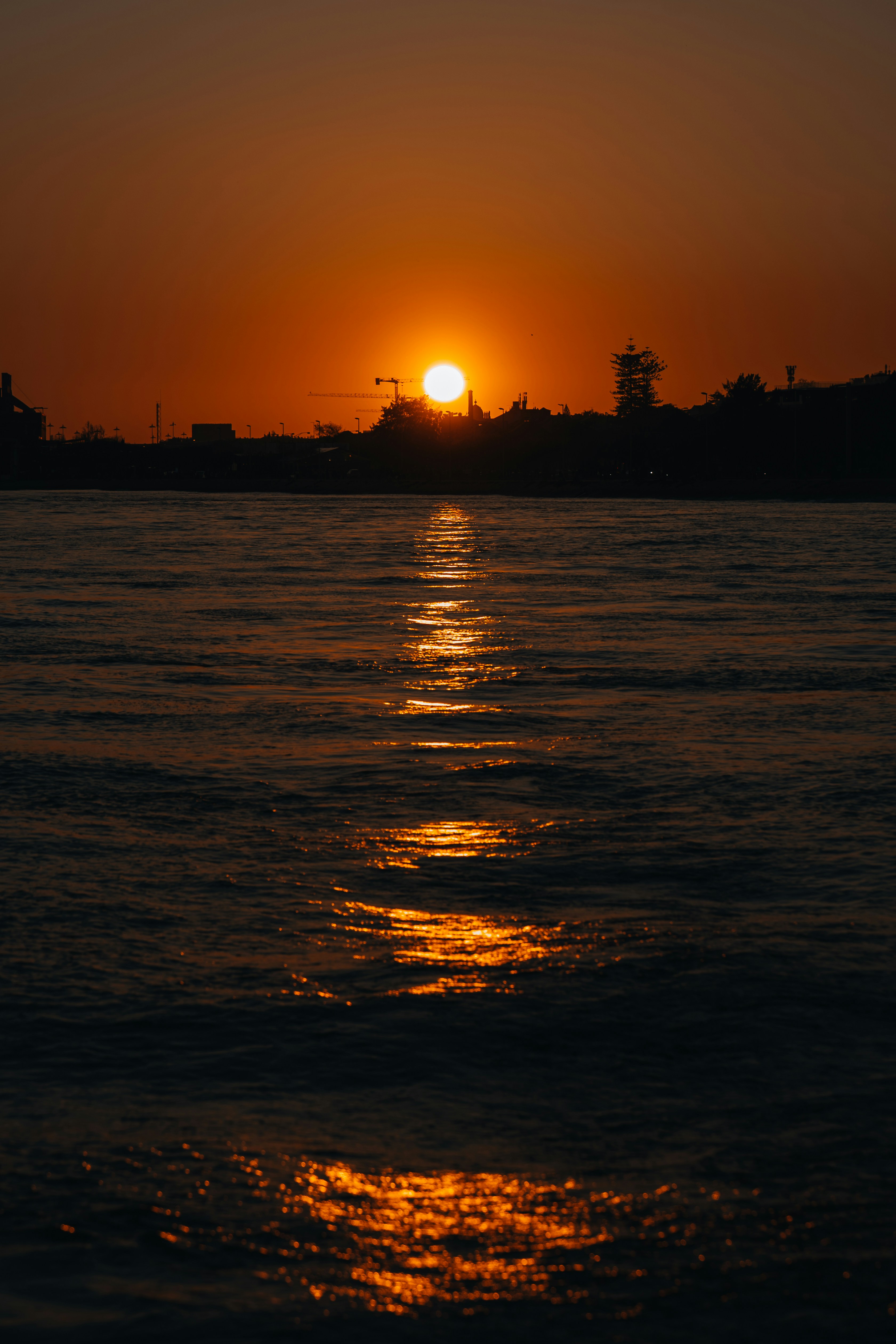 Sunlit Horizon Over Calm Waters at Dusk