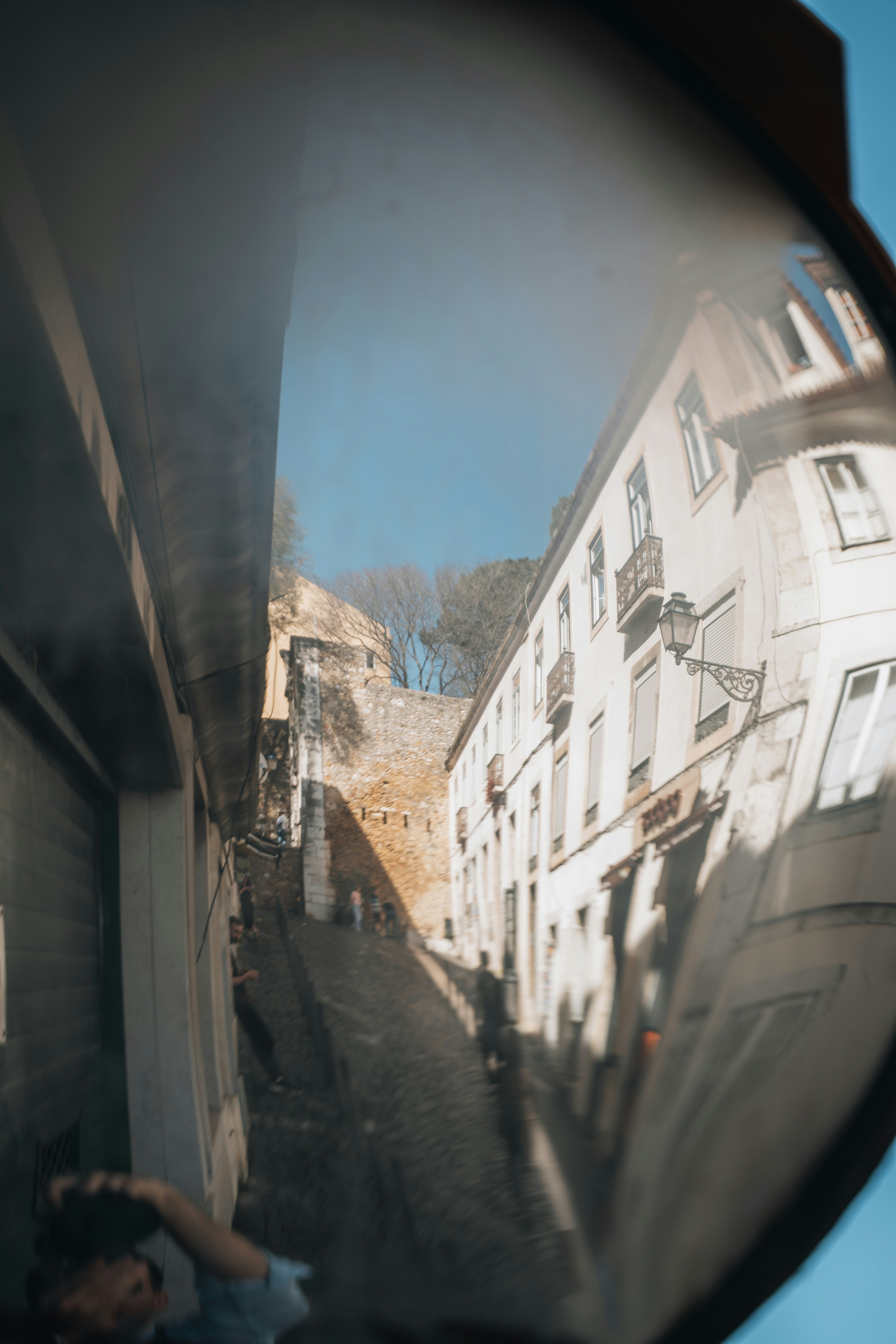 Circular Window to a Narrow European Street