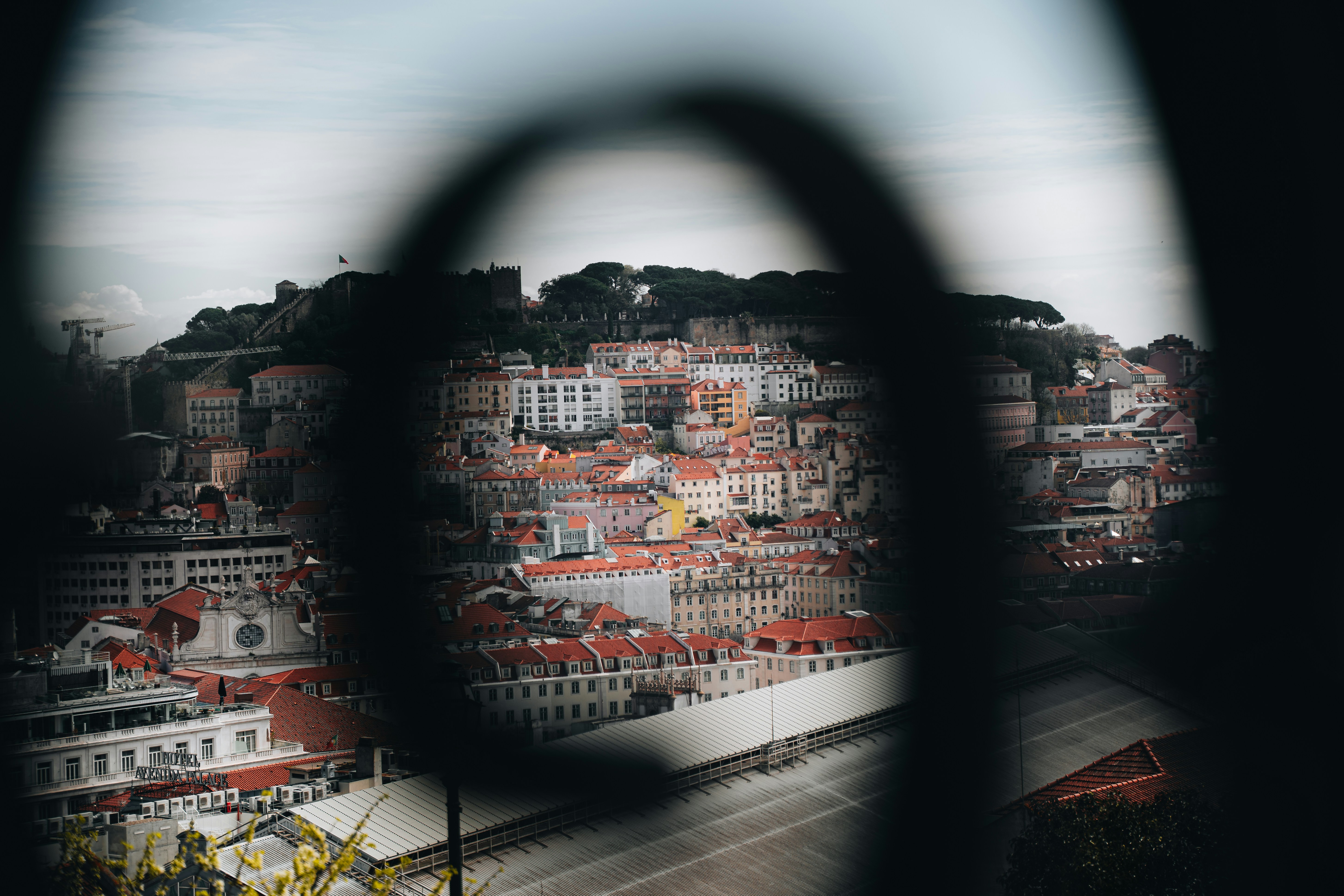 Through the Ring: Cityscape Framed by a Circular Viewfinder