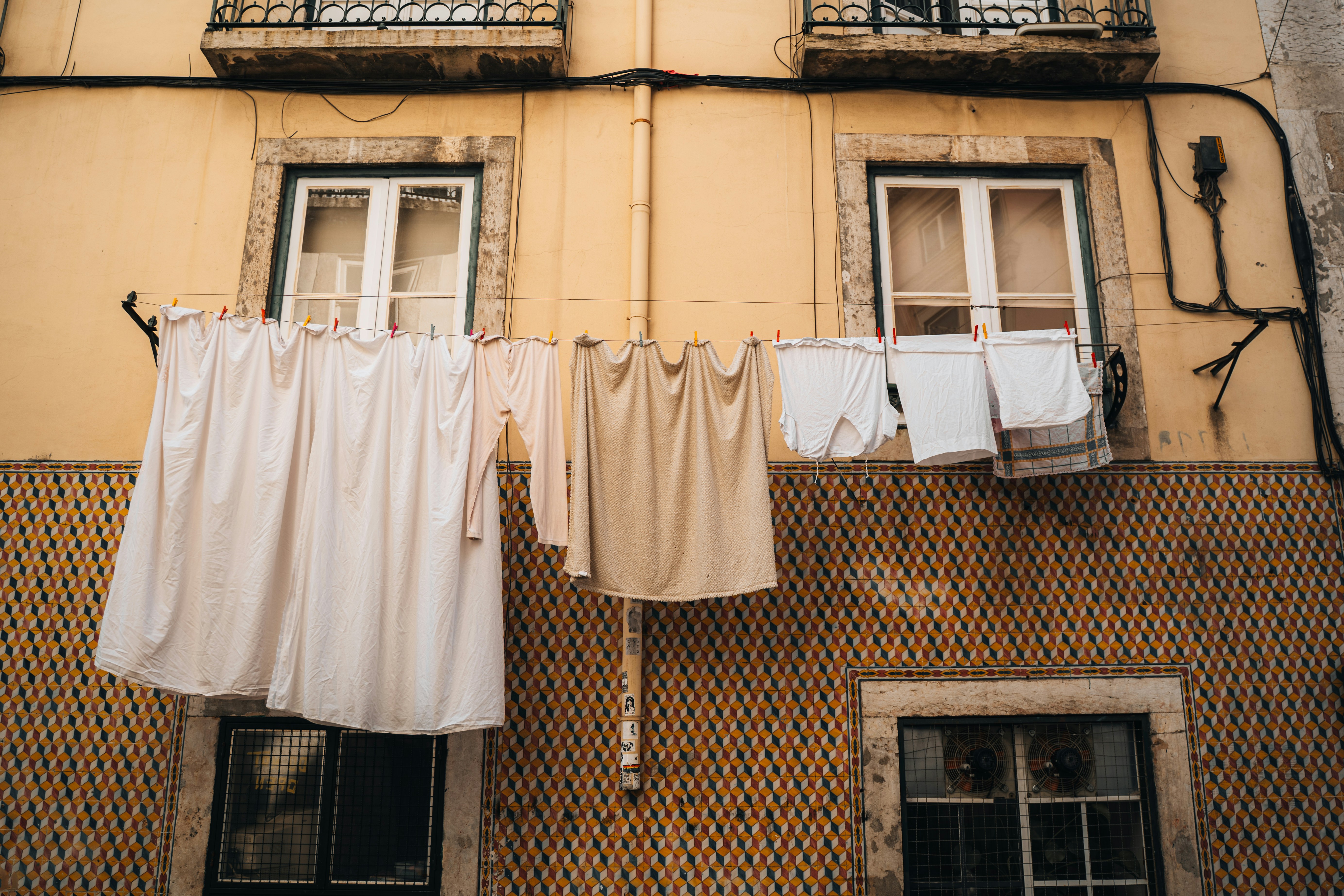 Line of Laundry Across a Sunlit Facade