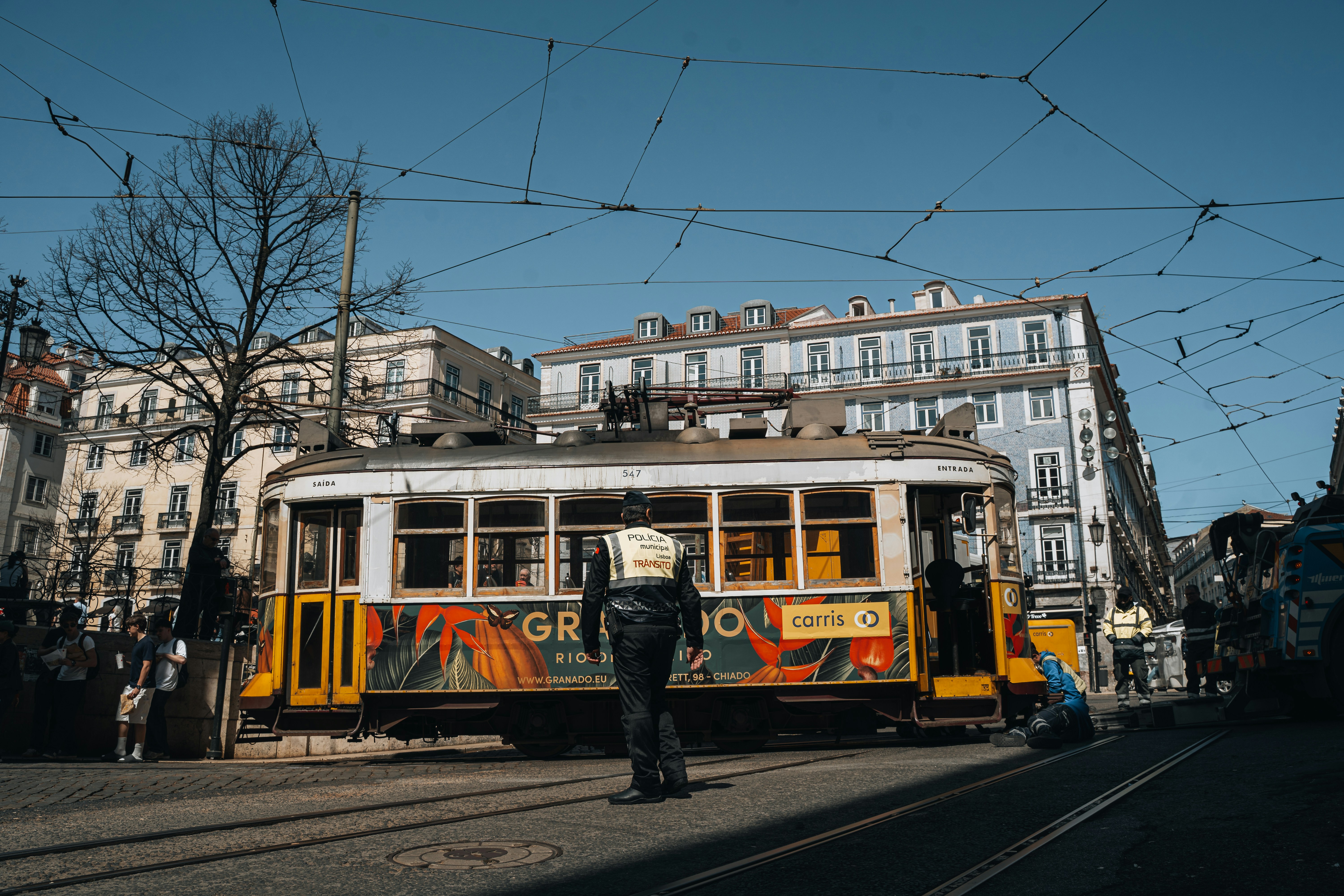 Yellow Tram at the Heart of a European Street