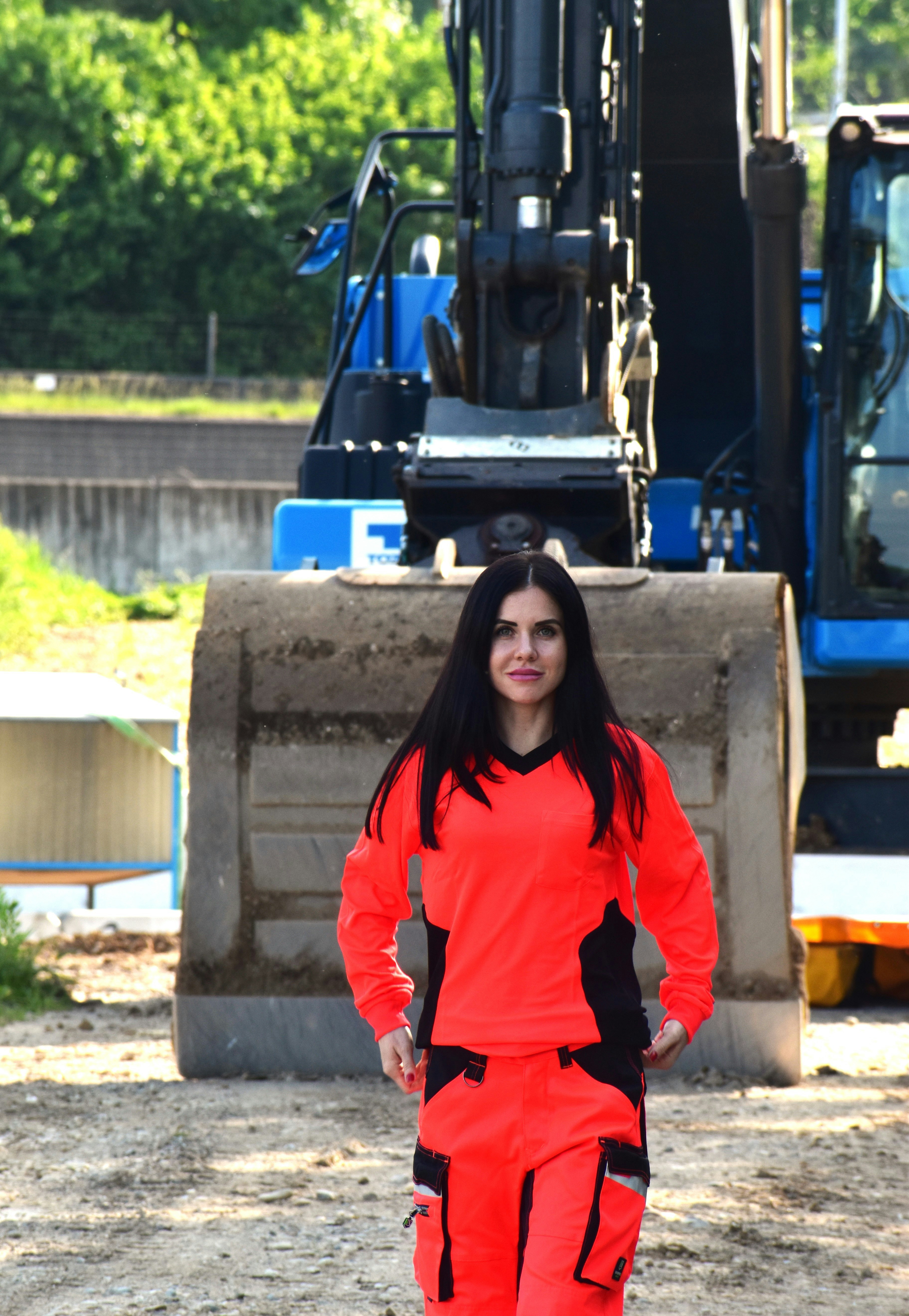 Workwear Portrait with Heavy Machinery Backdrop