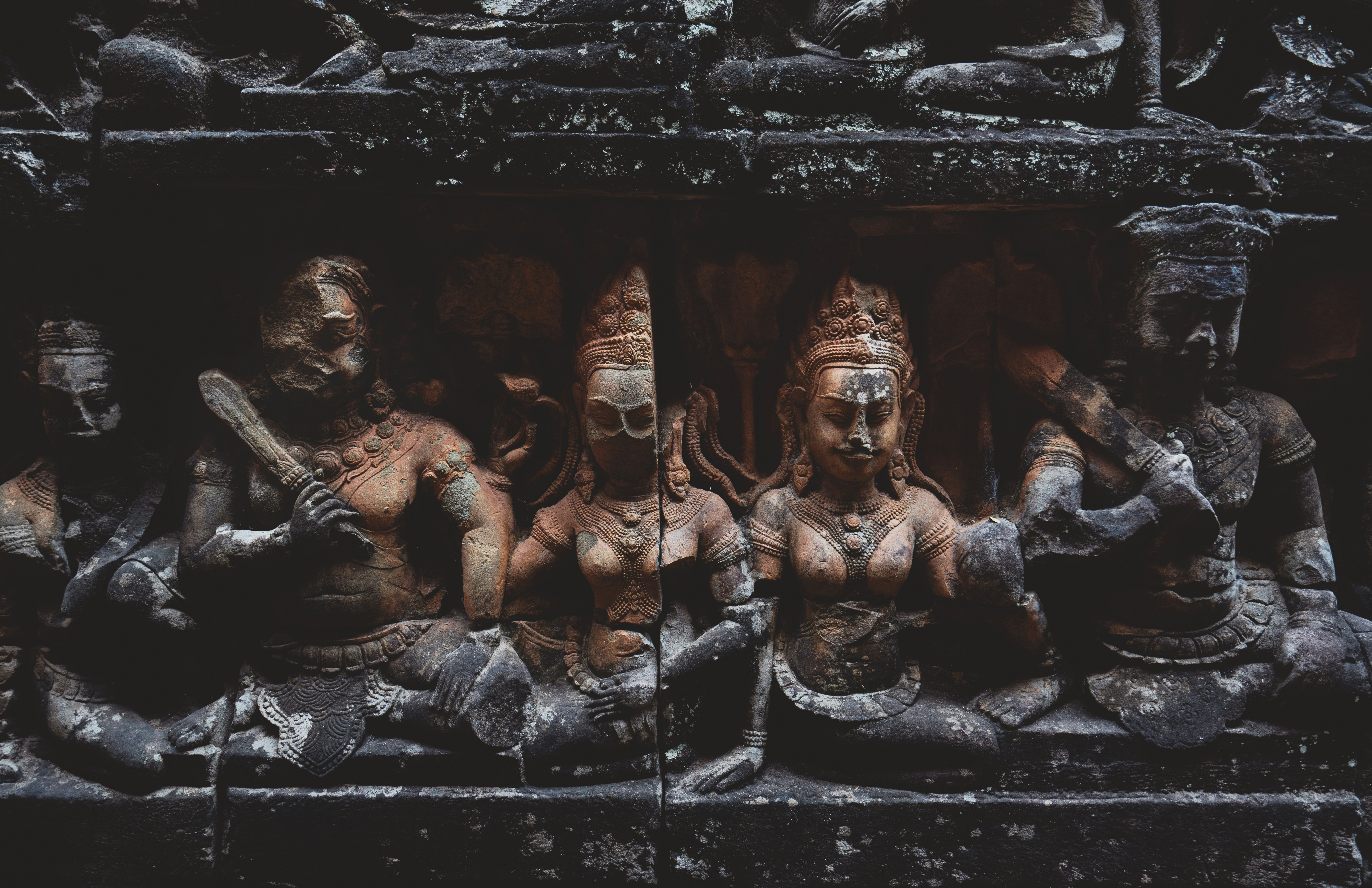 Carved Guardians in Shadow: Ancient Relief Beneath the Gate