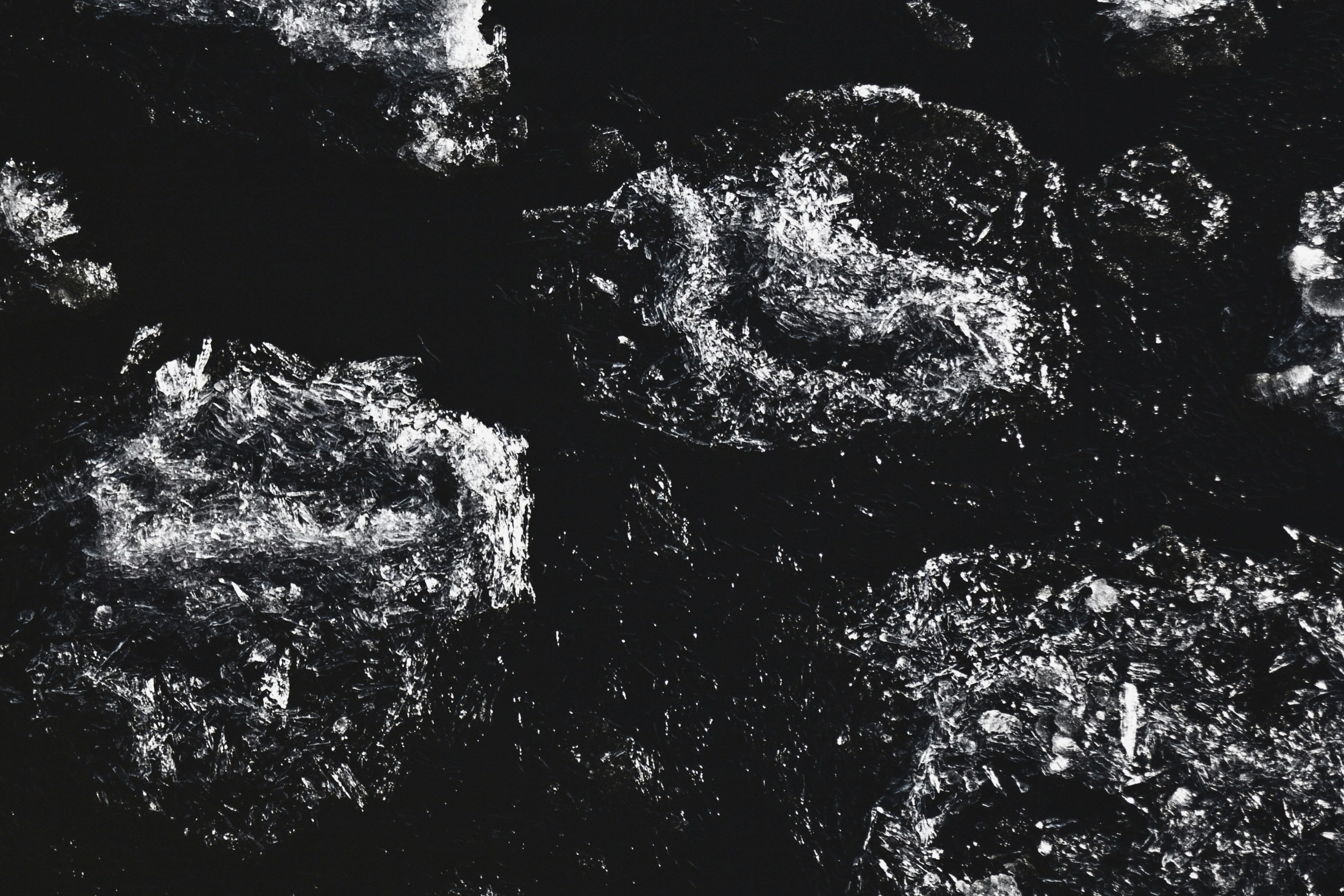Monochrome Granite: Abstract Texture in Shadowed Ridges