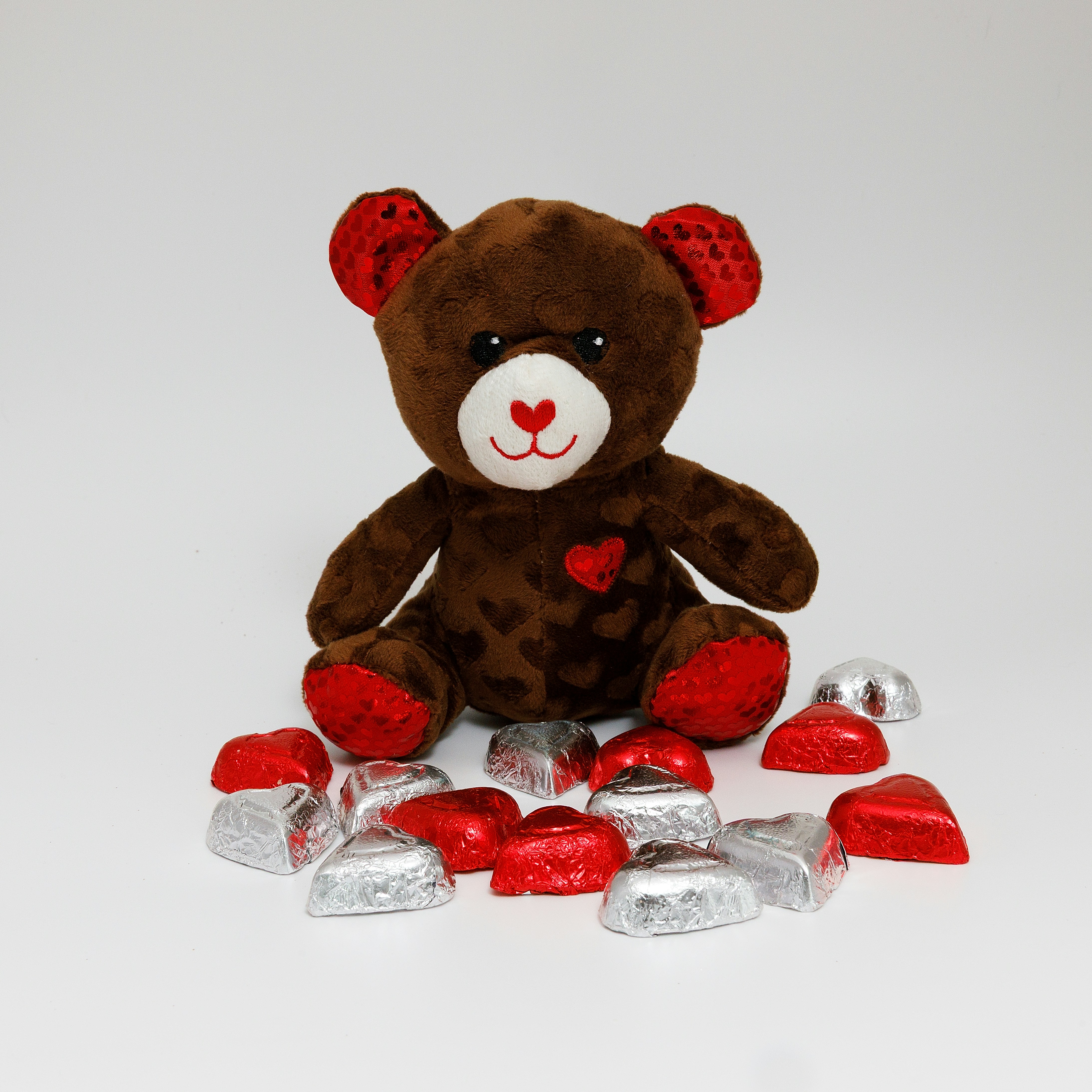 Valentine's Plush: Chocolate Bear Among Red and Silver Hearts