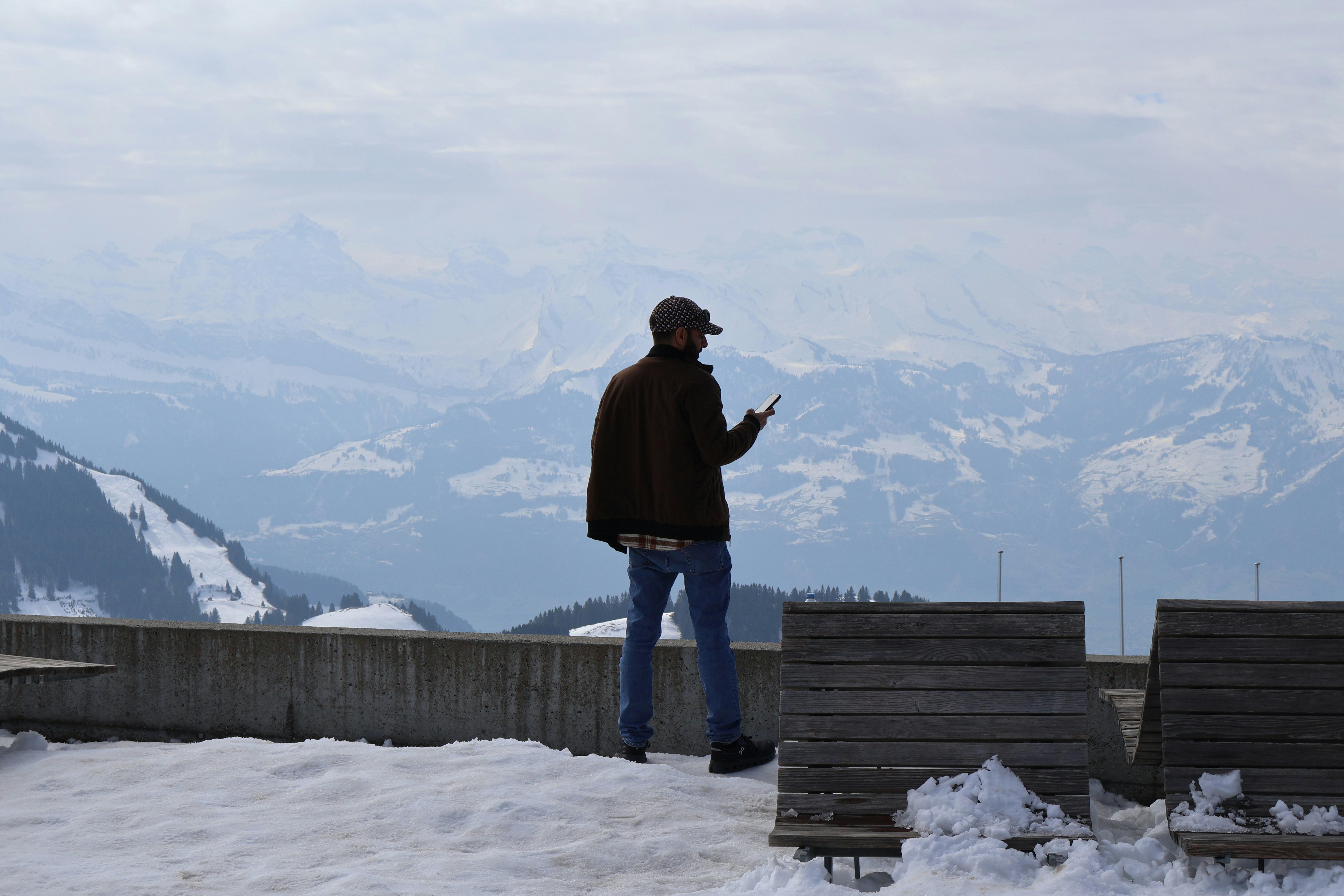 Horizon Talk: Man in a Snowfield Beneath Alpine Silence