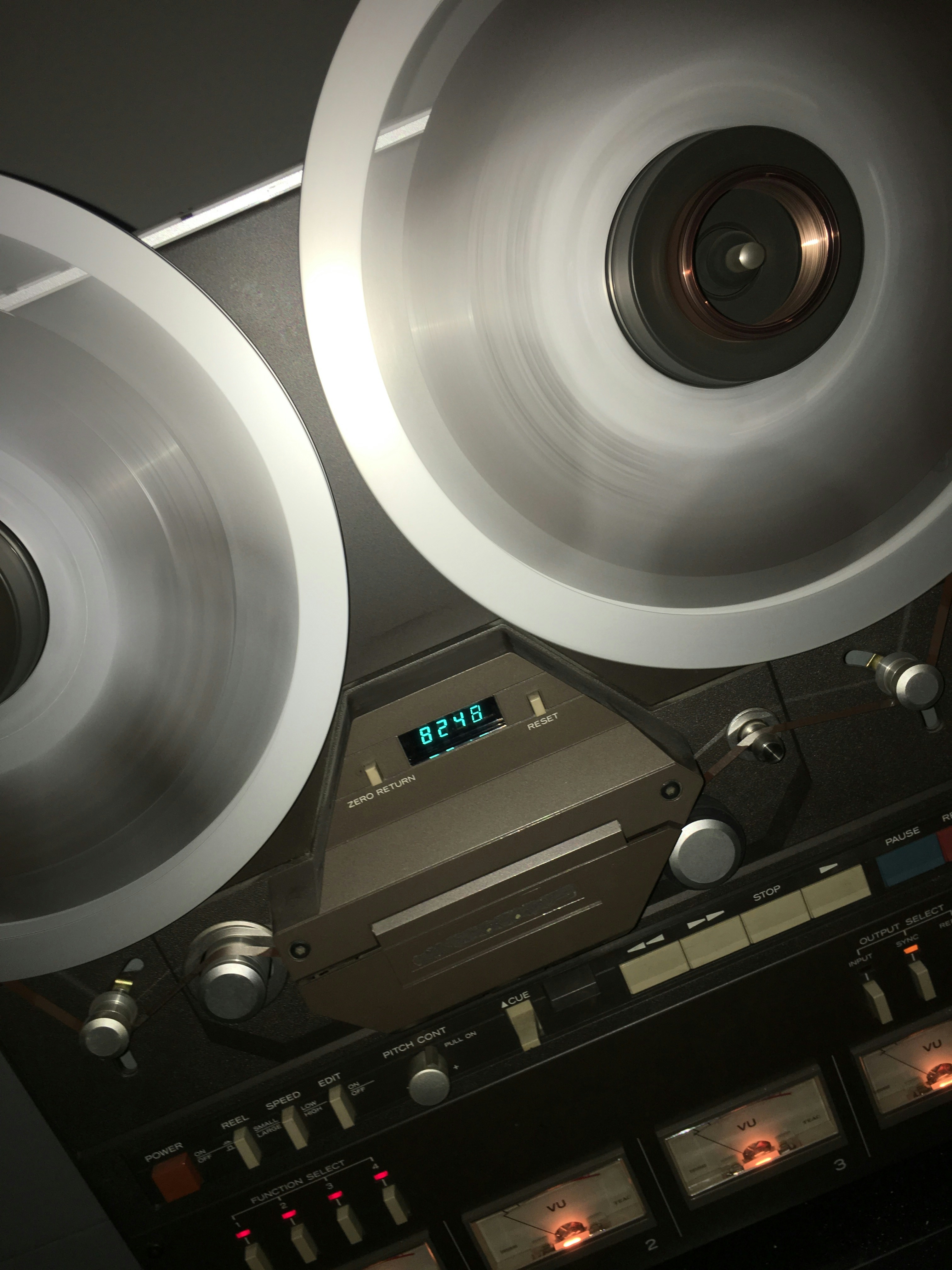 Rotating Spindle Echo: A Vintage Tape Recorder with Spinning Drive Wheels