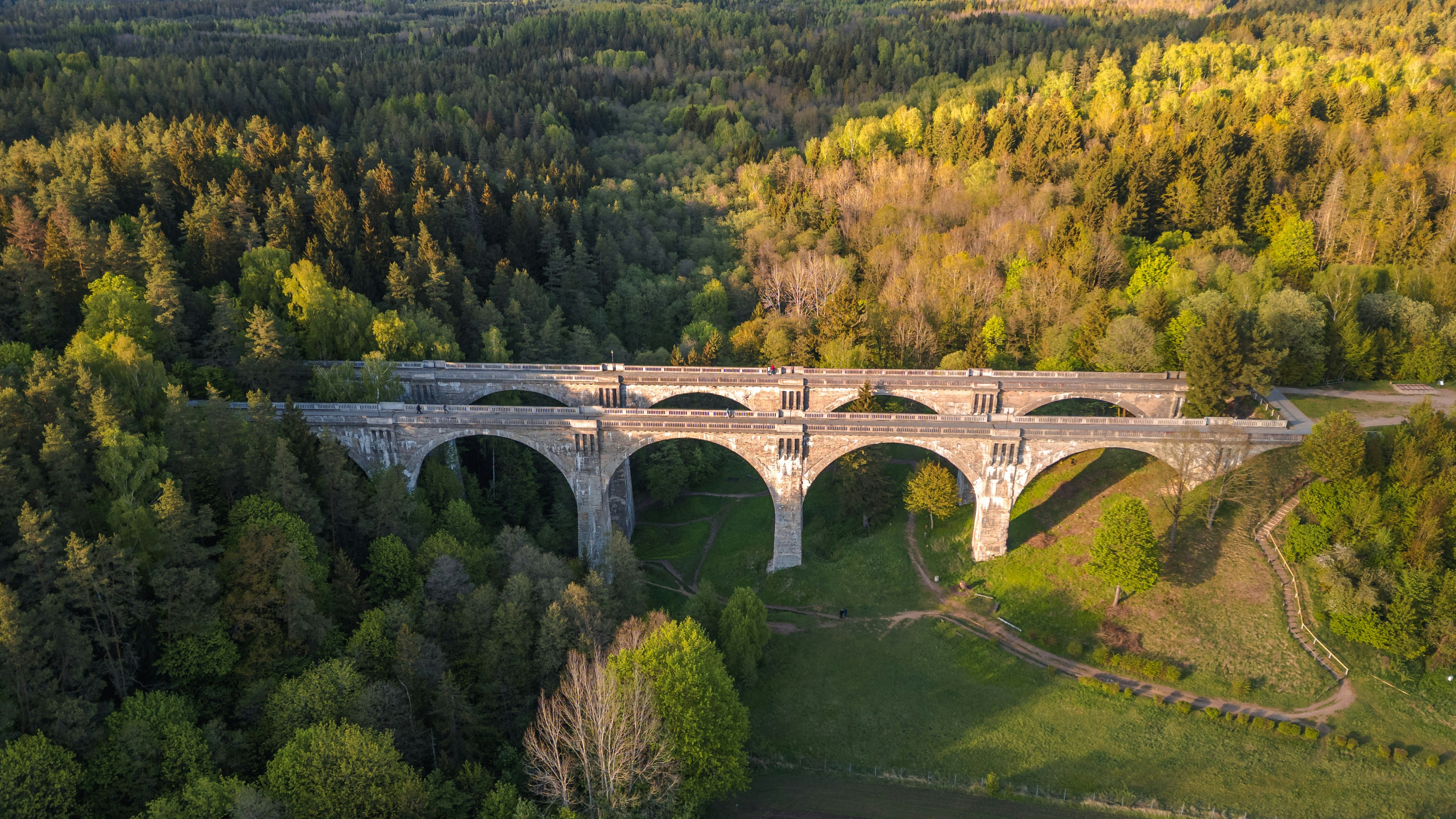 Autumn Viaduct Arches Surrounded by Forested Hills