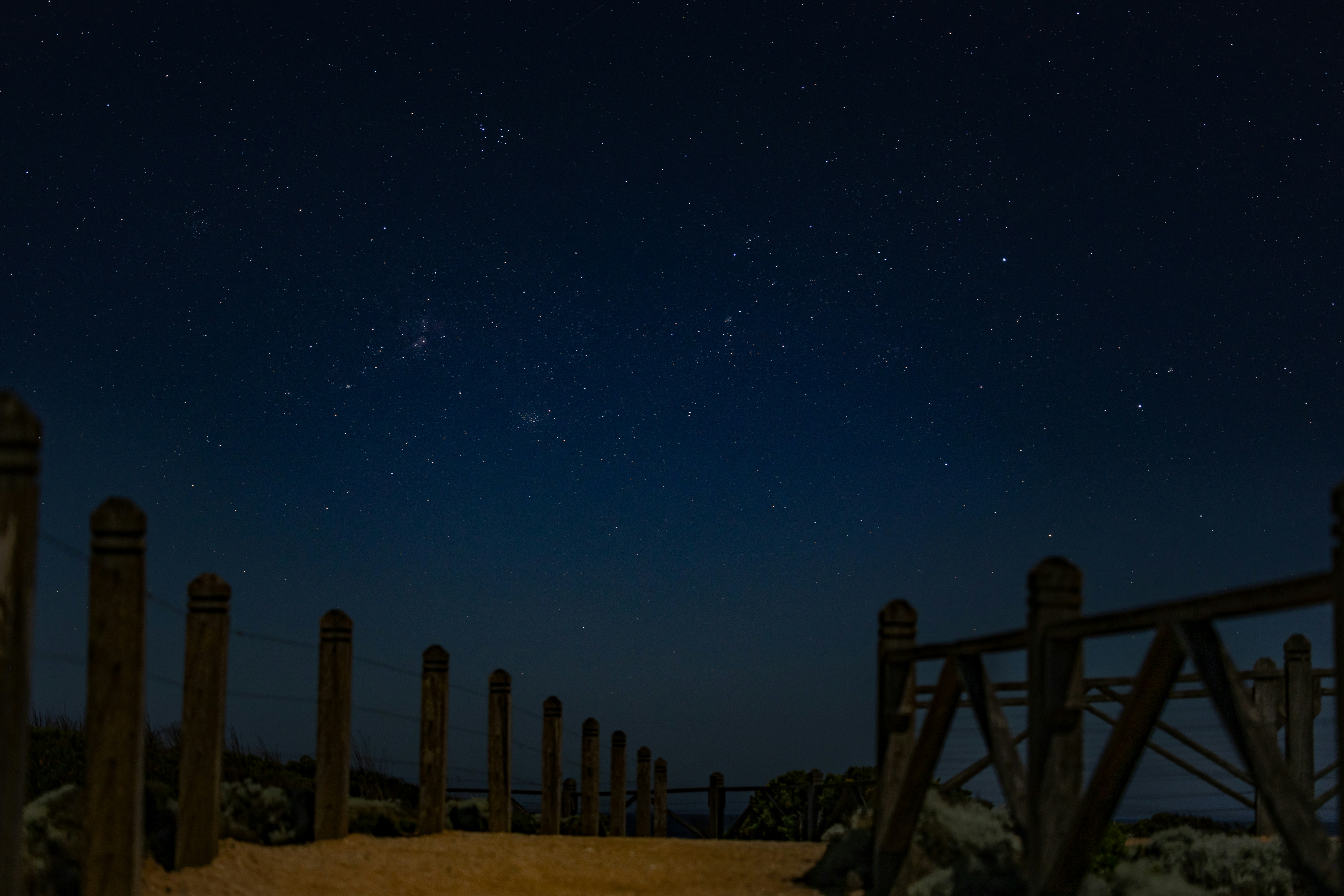 Stellar Rails: Night Sky Over a Secluded Path