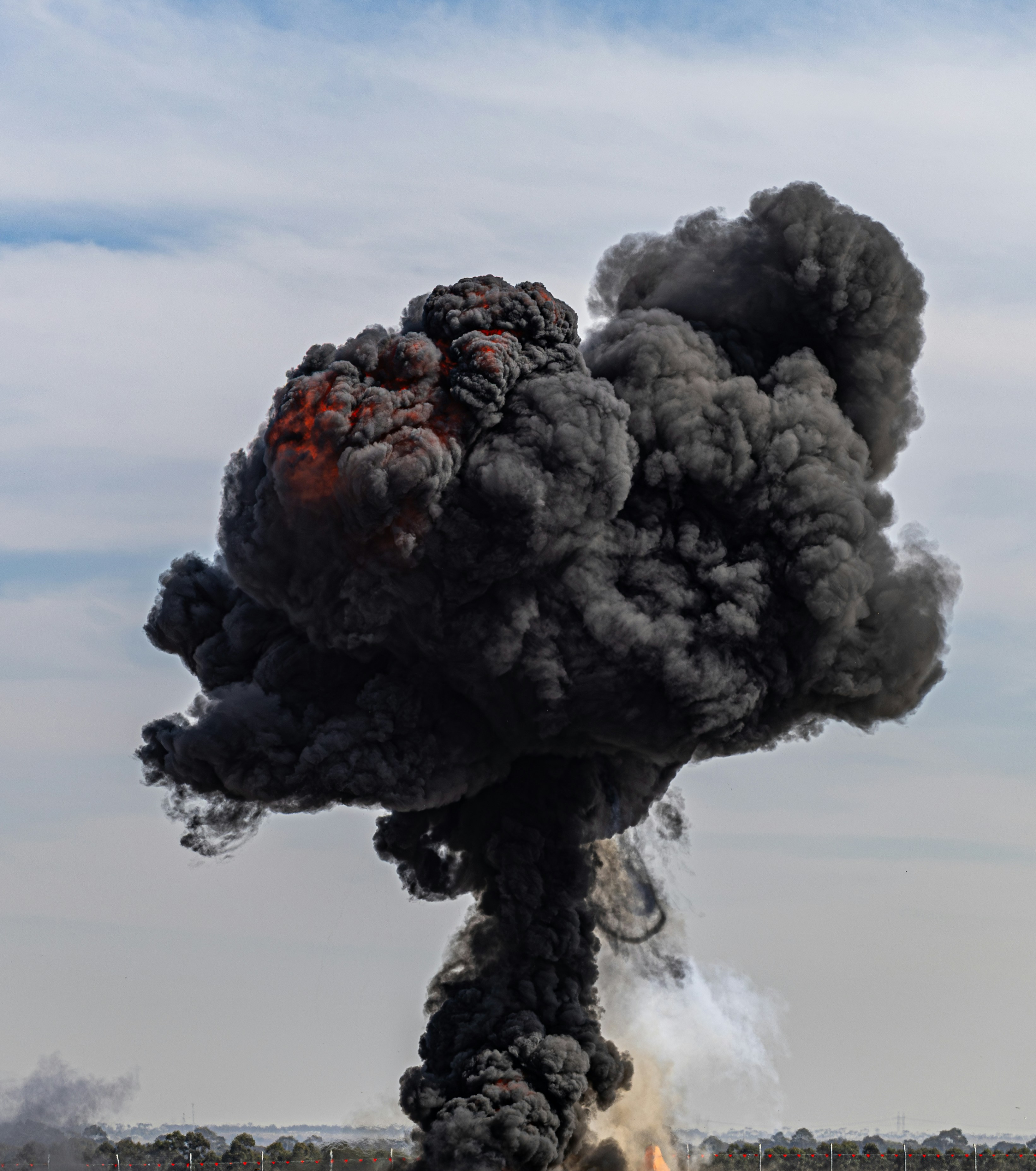 Rising Plume: Volcanic Smoke Looms Over the Flat Horizon