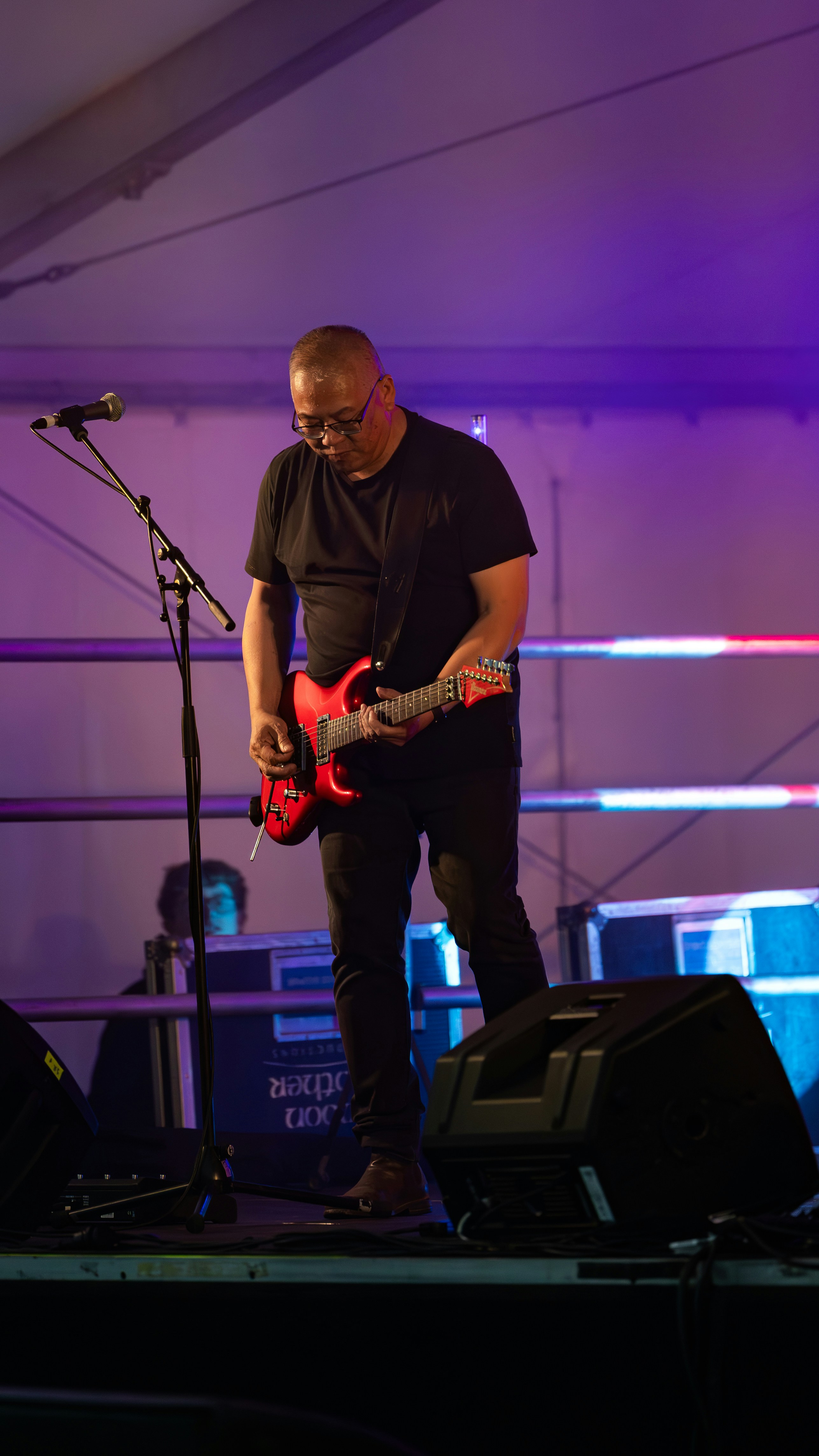 Red Guitarist in Purple Spotlight
