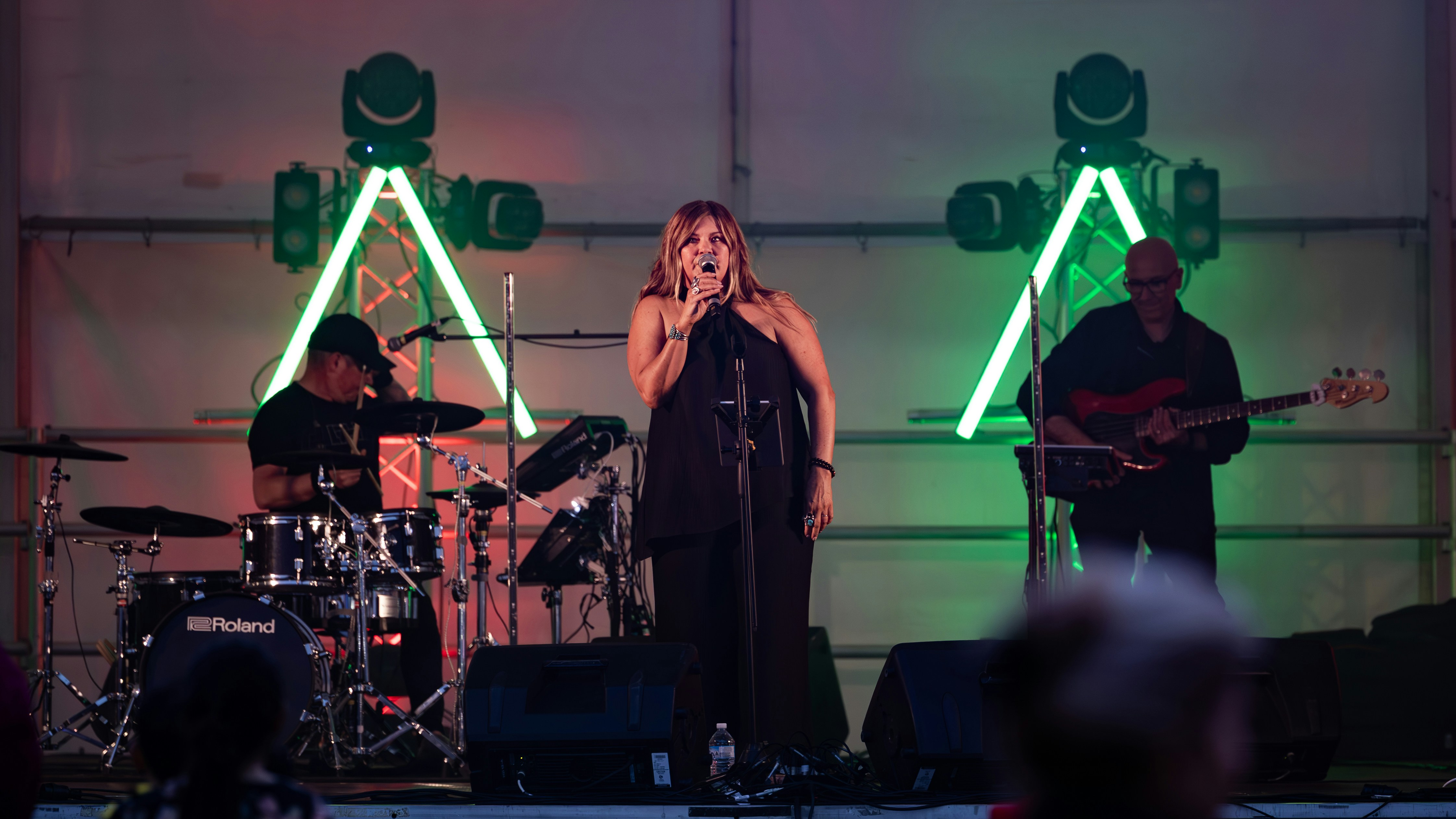Neon Triangles and a Vocal Moment on Stage