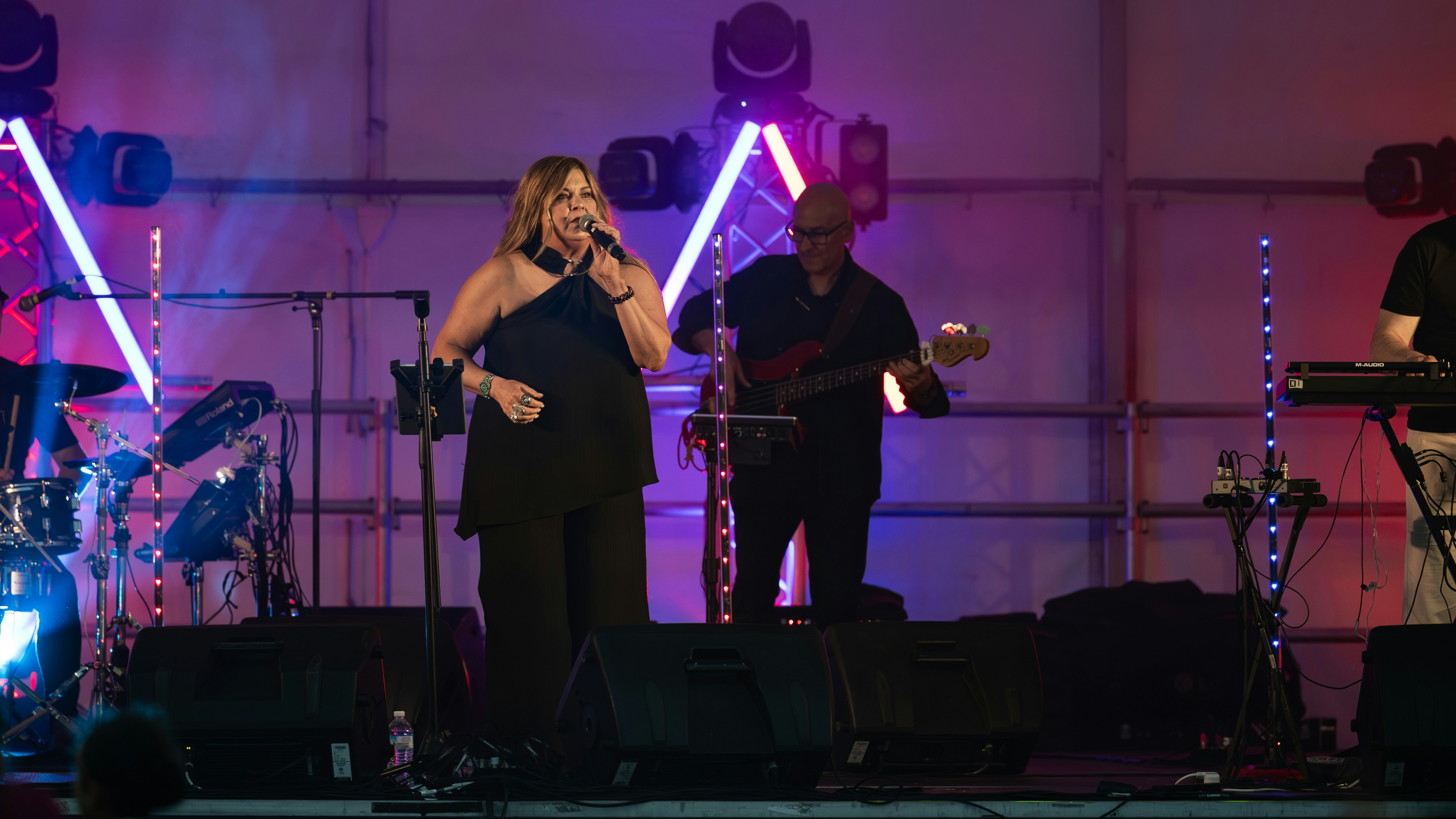 Midnight Mosaic: A Vocal Lead Under Neon Arcs