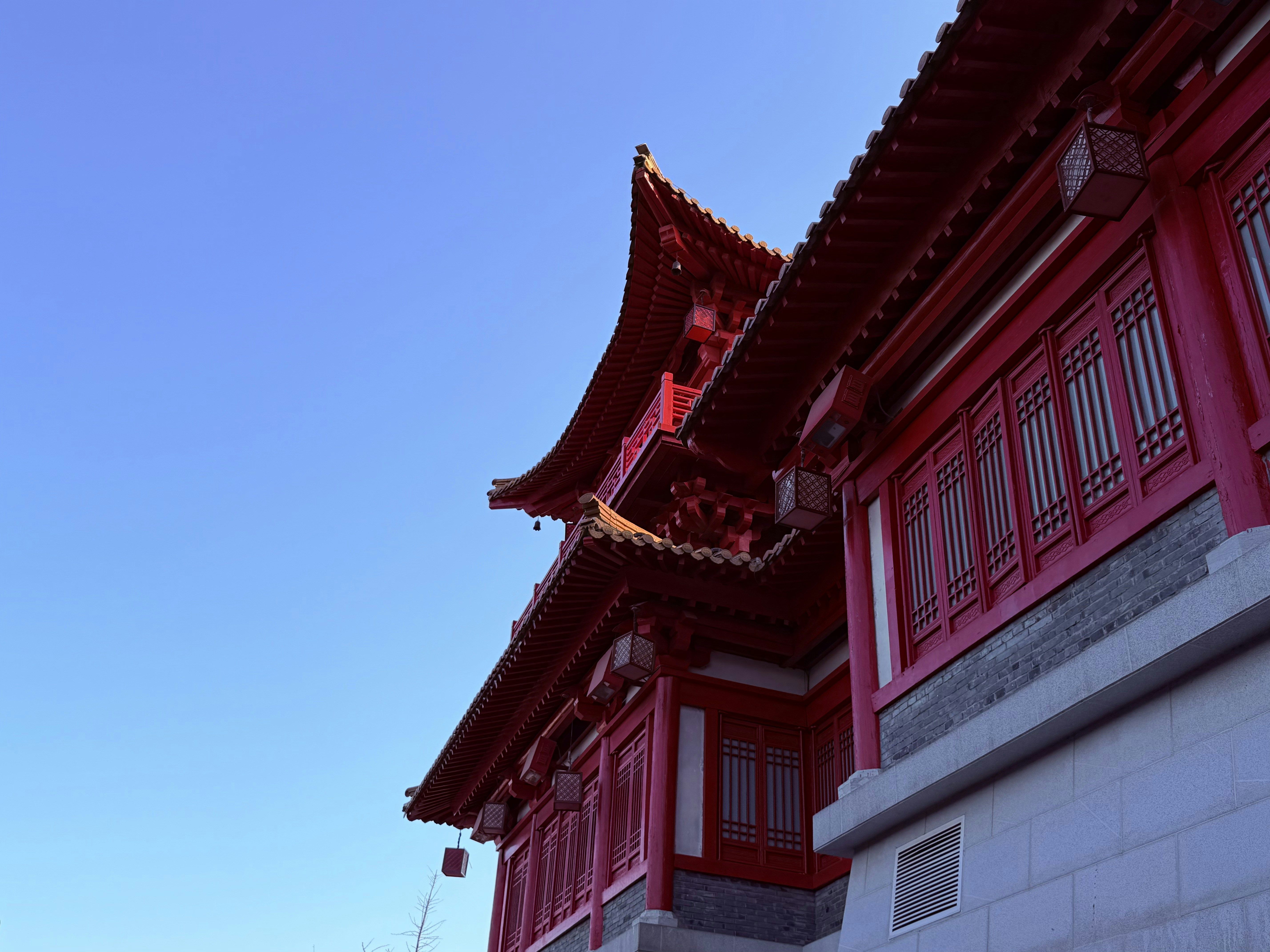 Red Timber Dreams: A Corner of Heritage under a Clear Sky