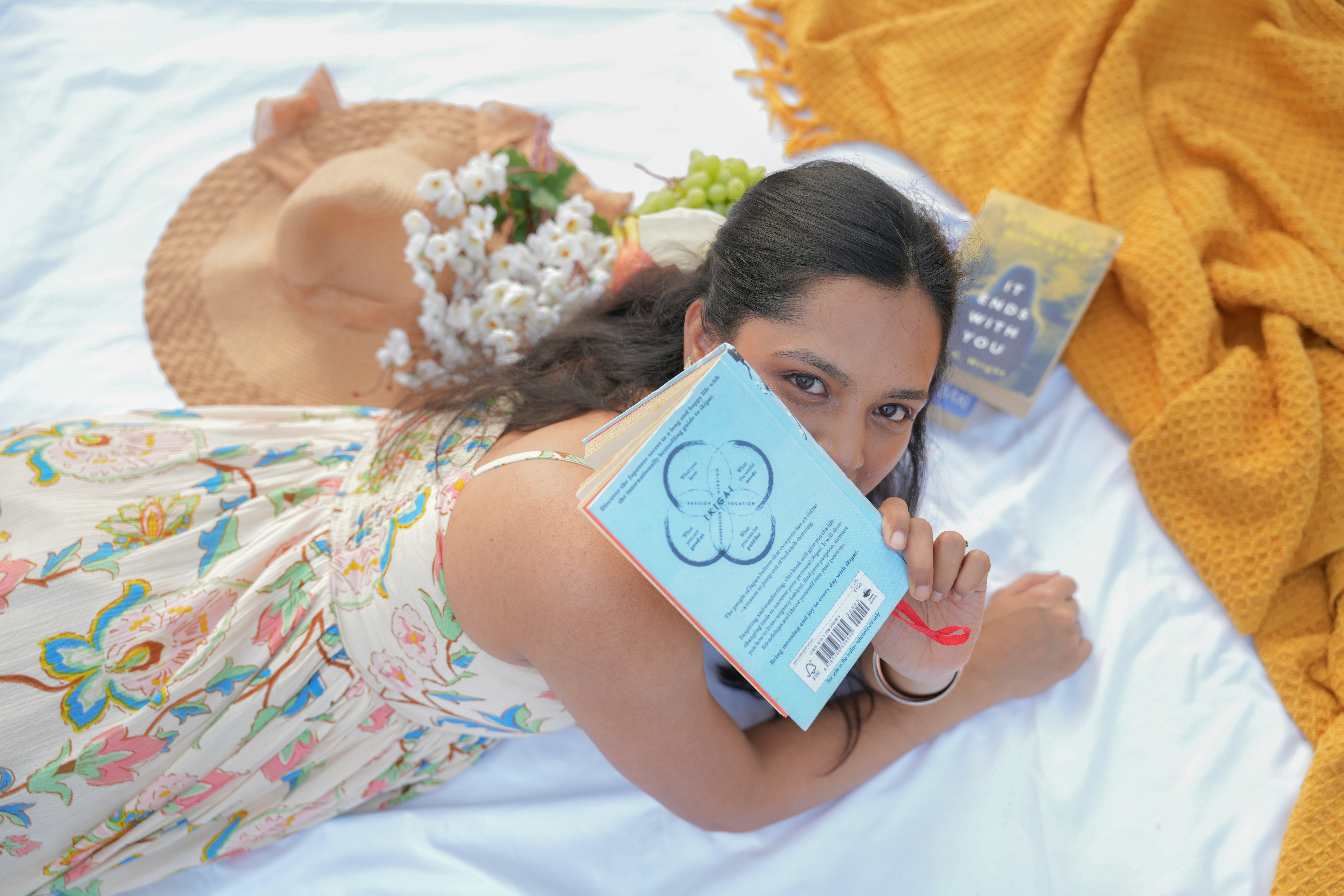 Portrait on a Picnic: A Bookish Moment Encircled by Sunlit Florals