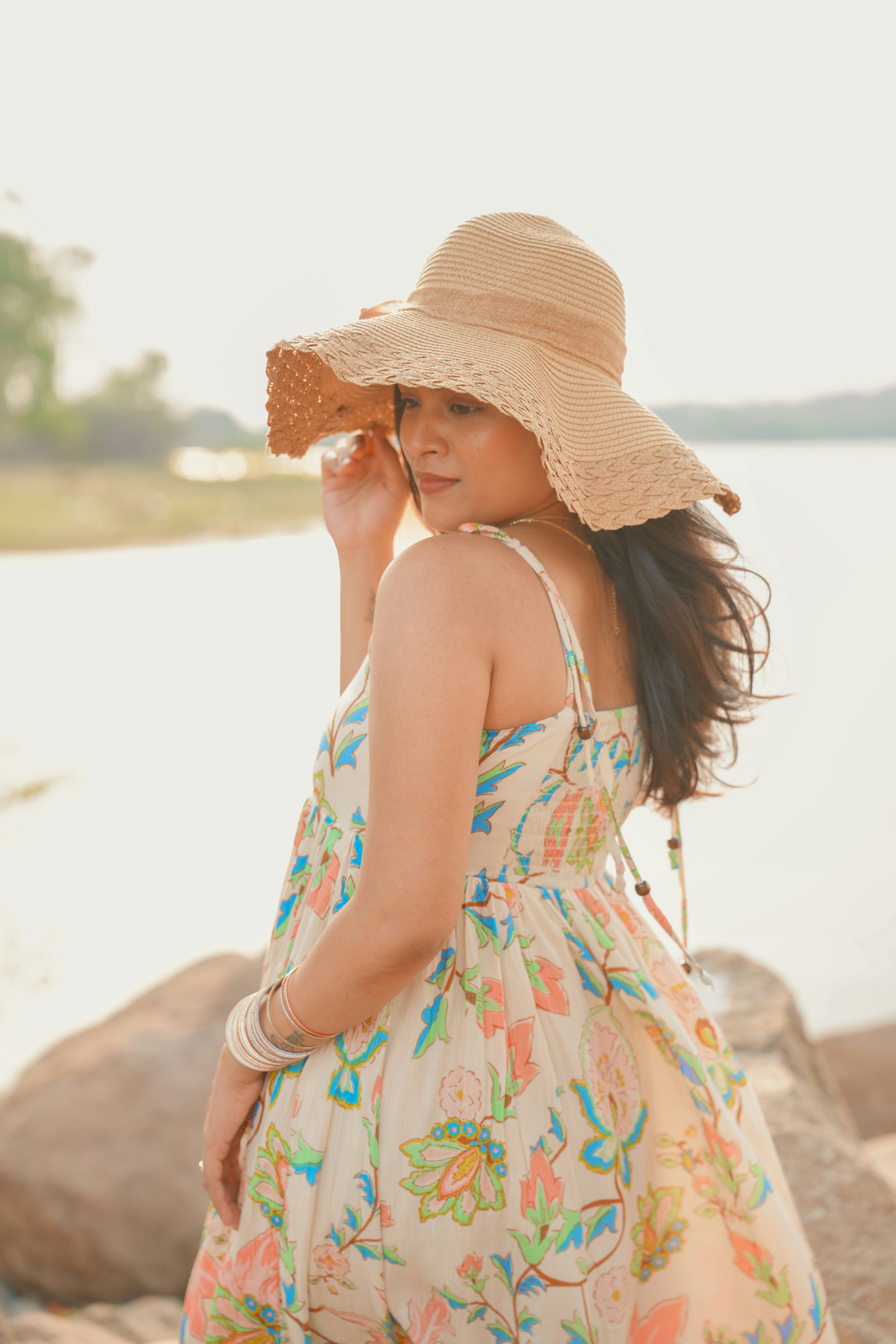Sunlit Summer Veil: A Portrait in a Floral Dress by the Water
