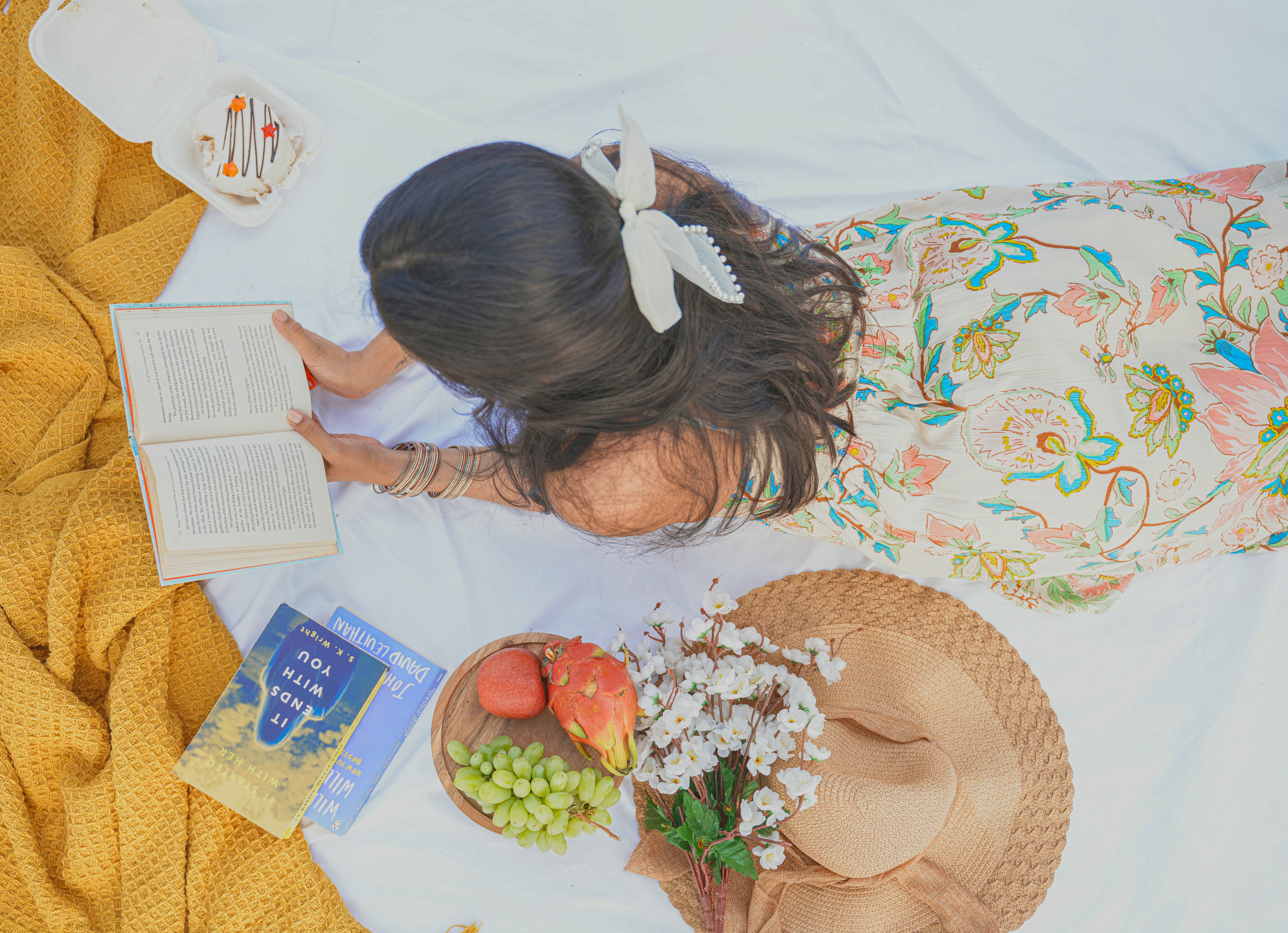 Cozy Picnic Read: A Quiet Moment Under a Floral Quilt