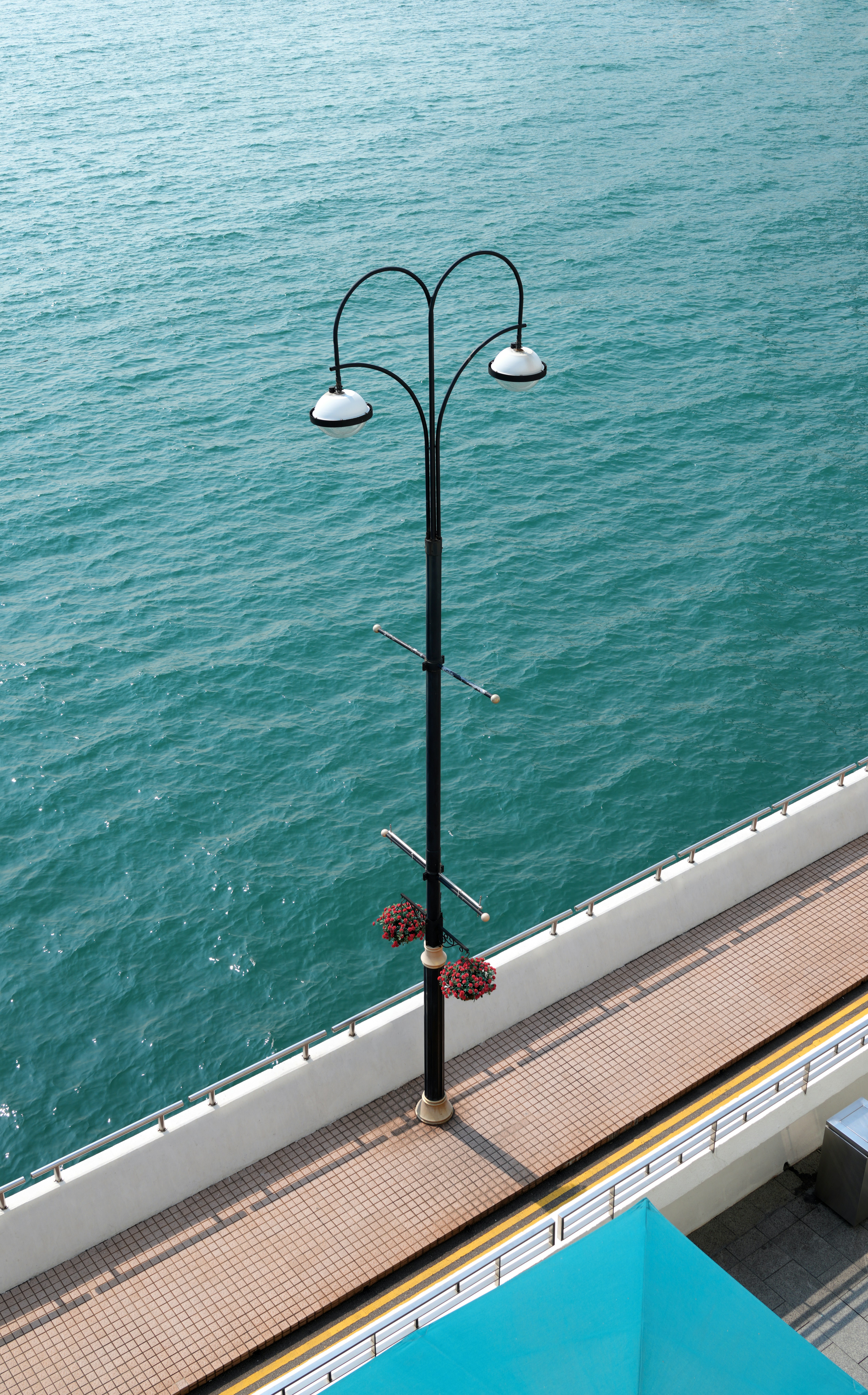 Twin-Arm Lantern over Azure Sea