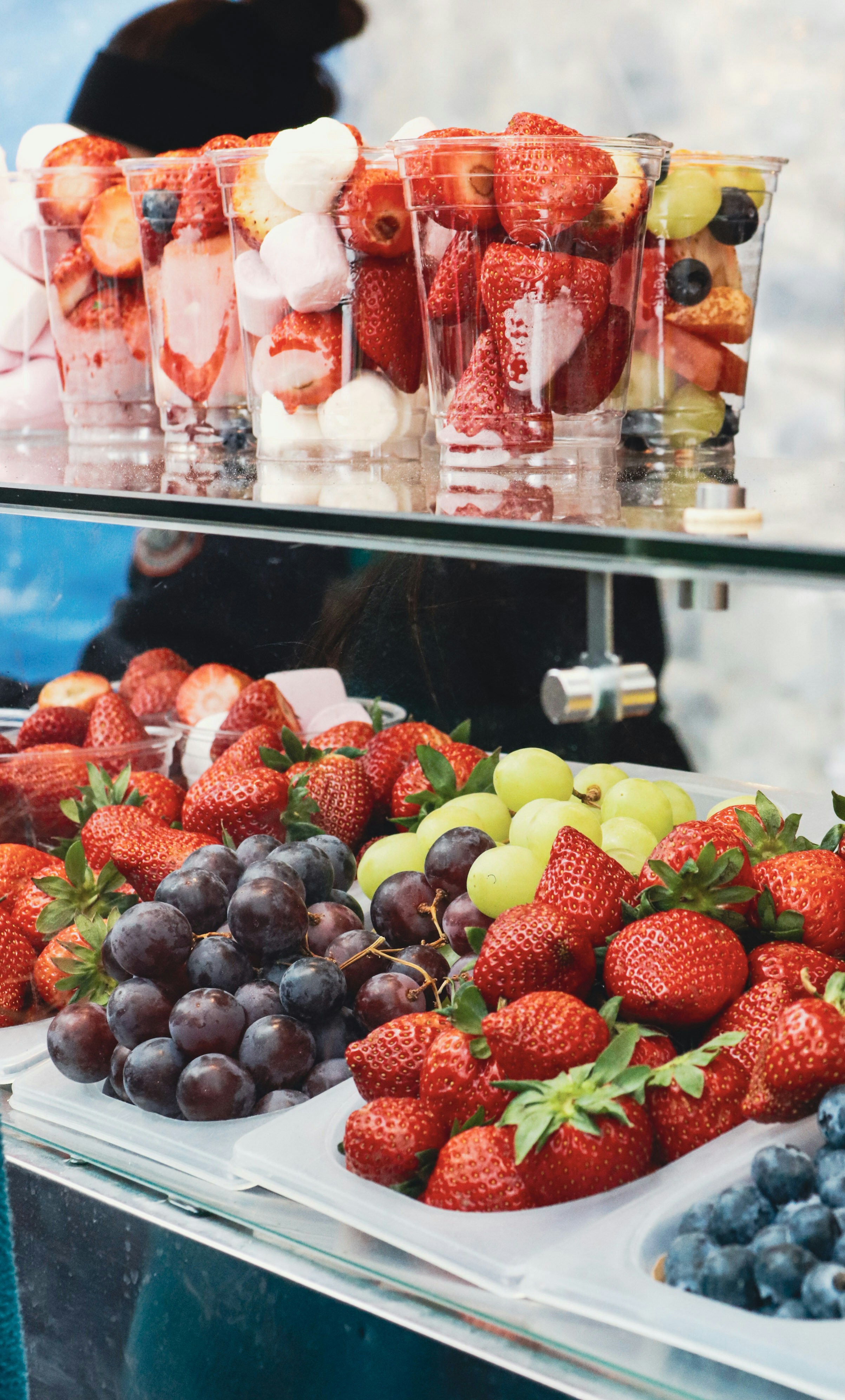Vibrant Fruit Display Beneath a Glass Bake of Color