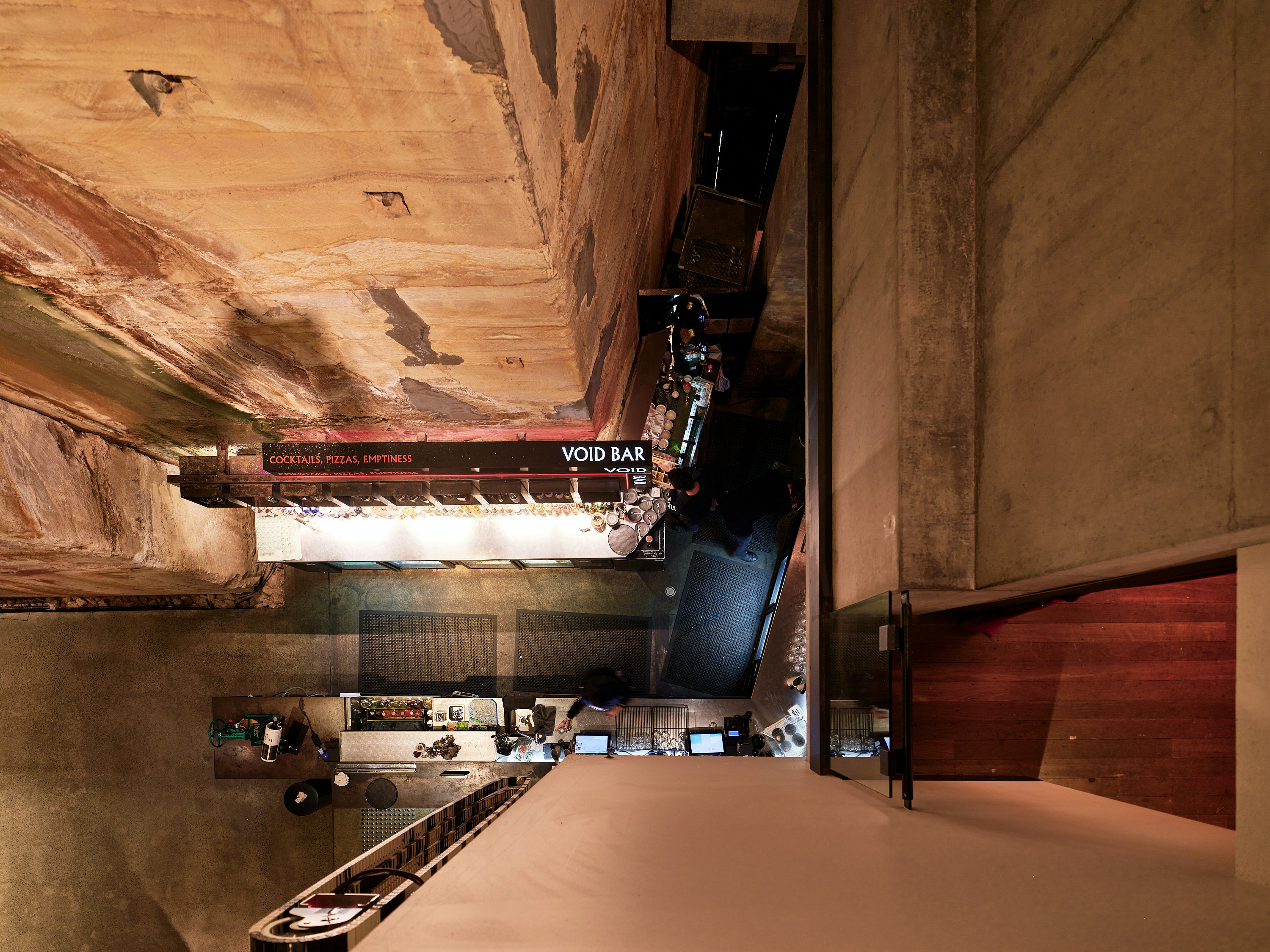 Edge of the Balcony Overlooking a Narrow Street Inside a Deep Shaft