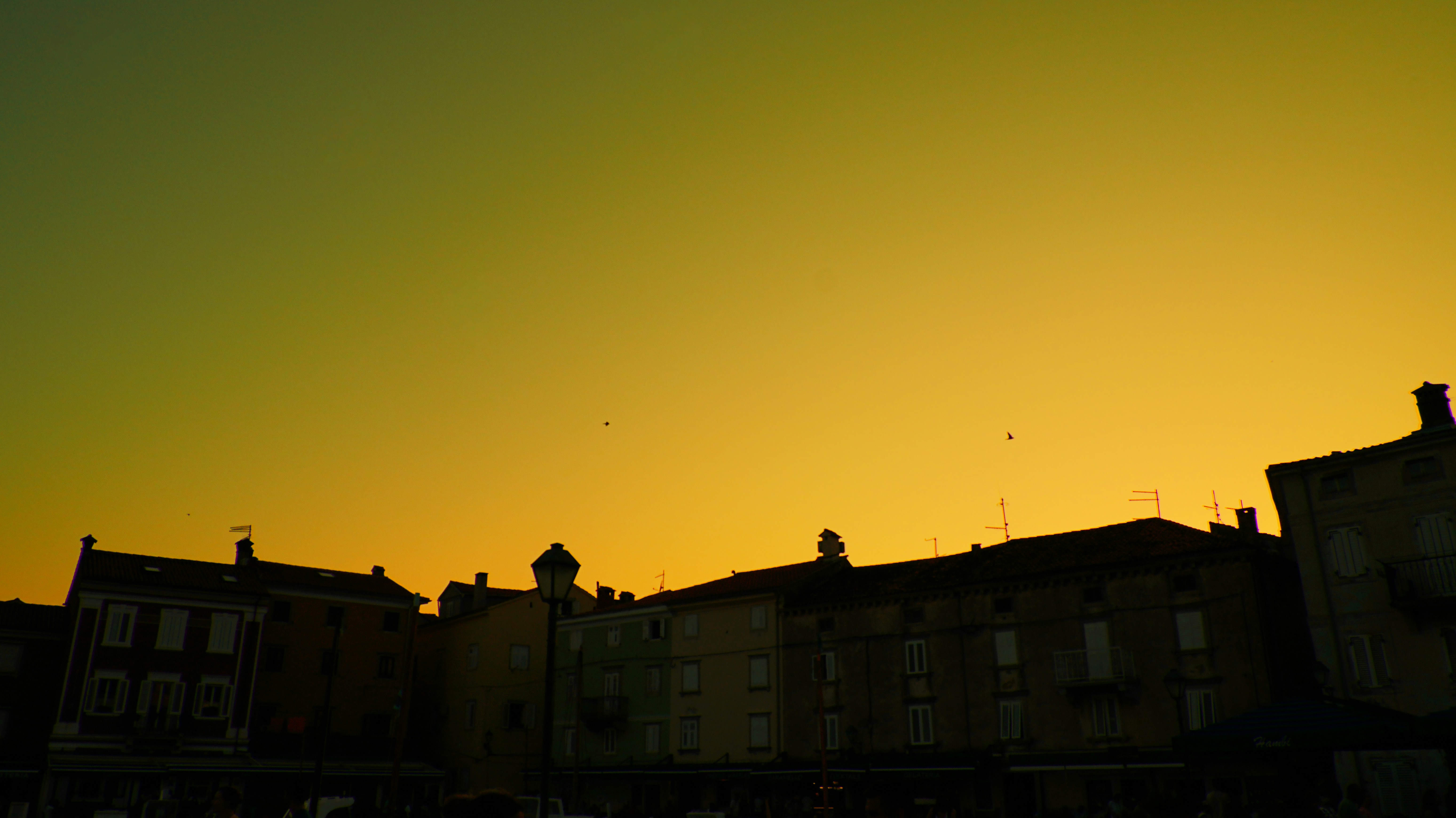 Sunset Silhouette Over a Quiet Row of Townhouses