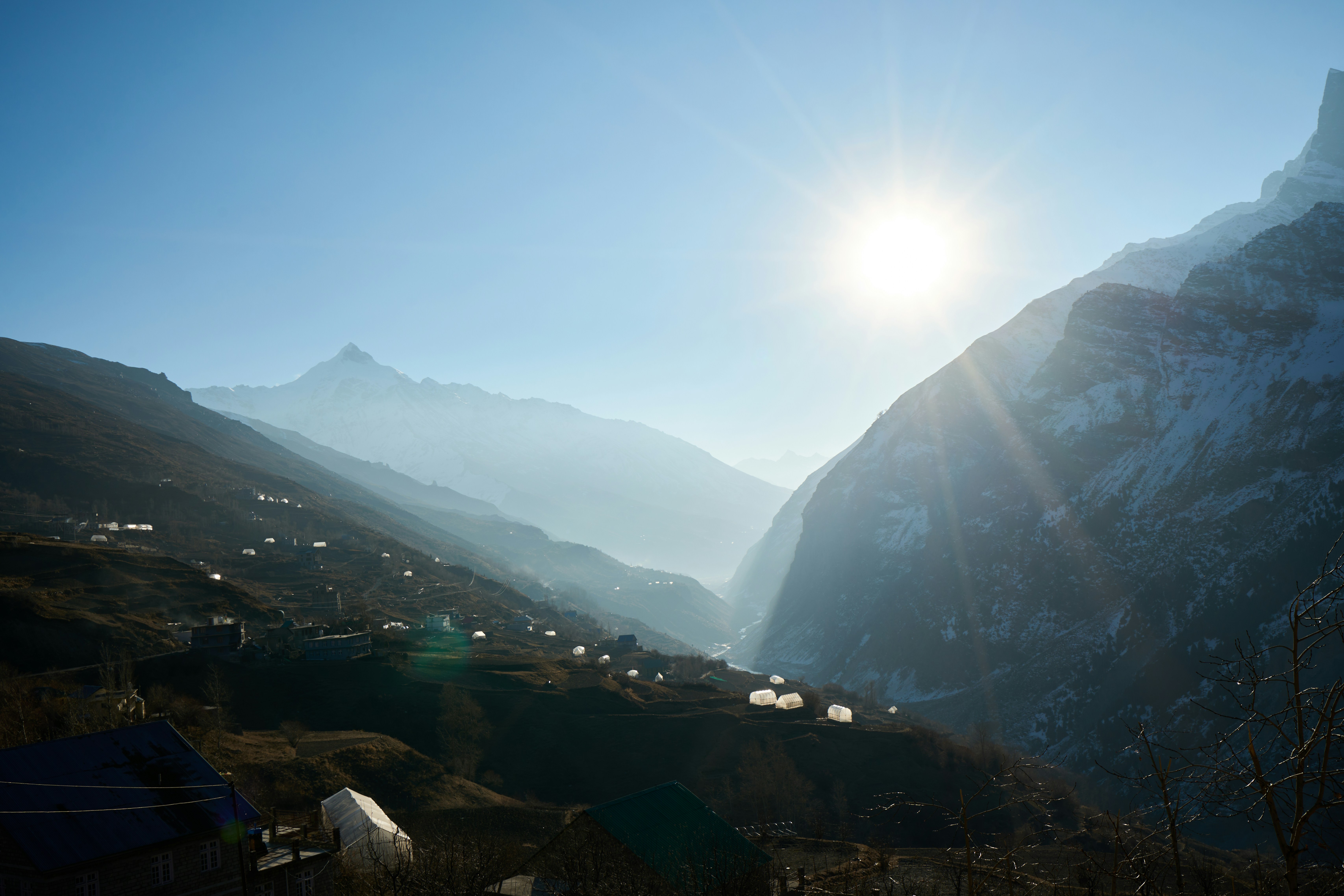 Sunlit Gorge: Valley Upon Valley Beneath a Radiant Peak