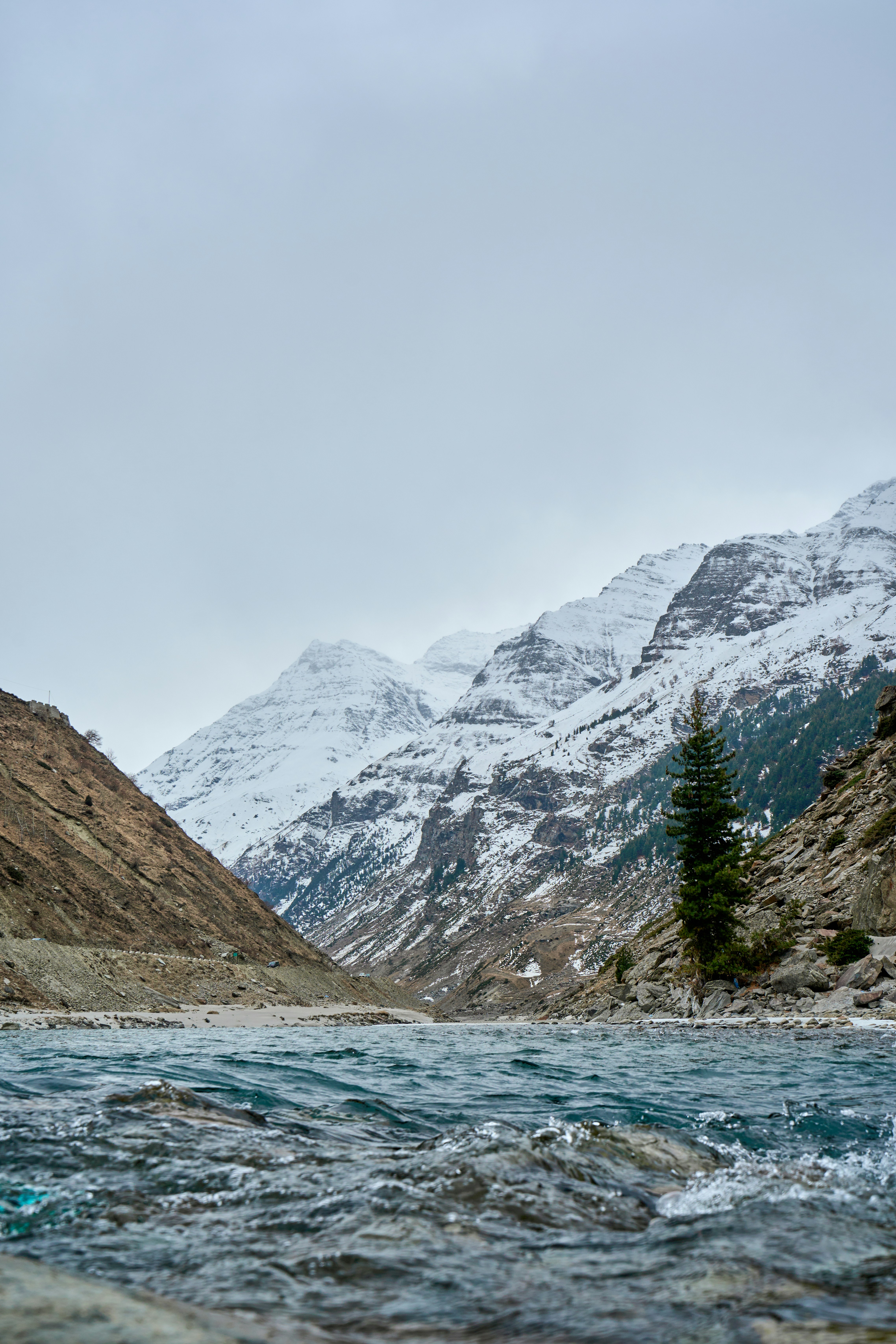 Snow-Capped Peaks Over Turquoise Alpine Lake