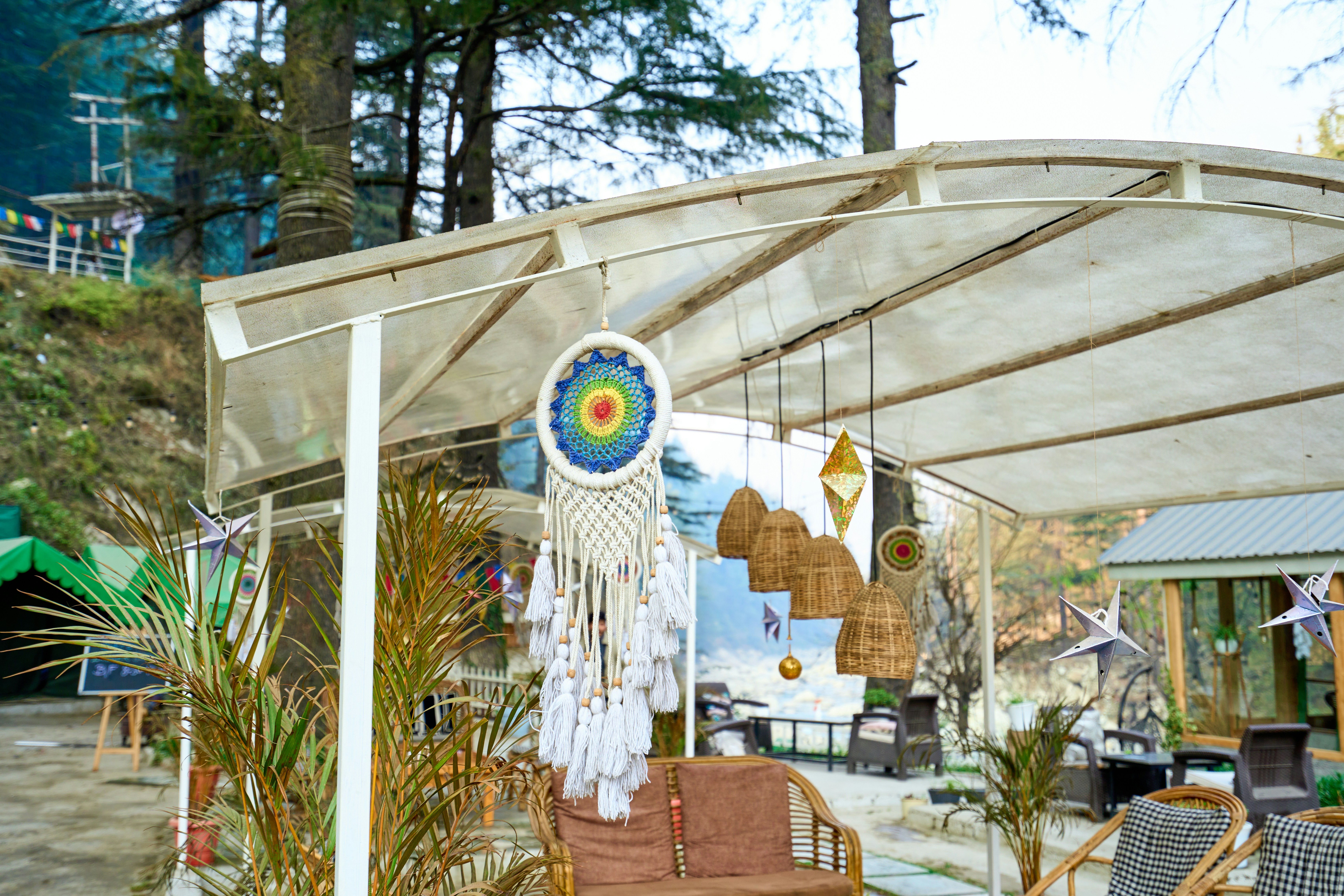 Dreamcatcher Terrace: Bohemian Market Under a White Canopy