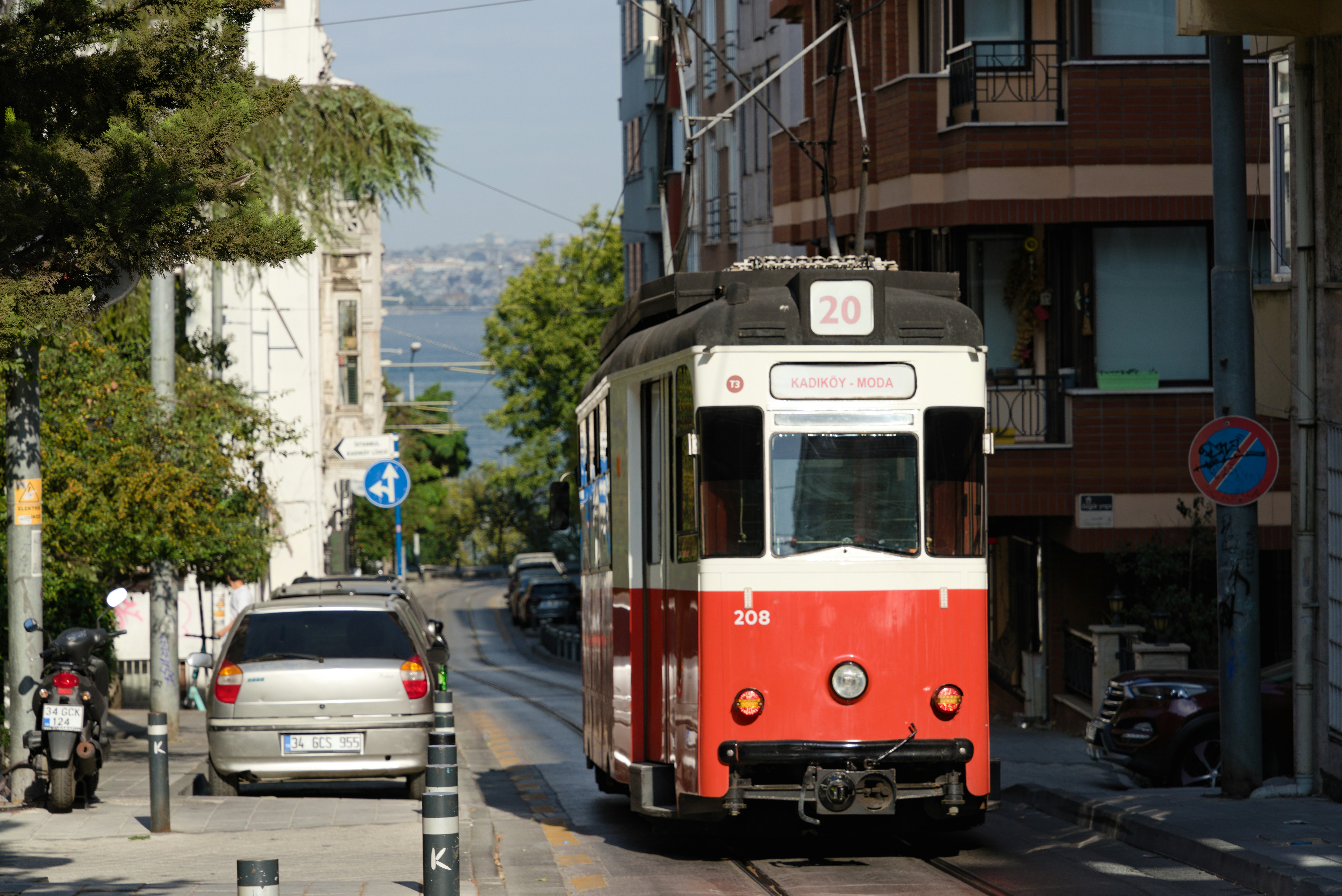 Red Tram on a Sunlit City Street