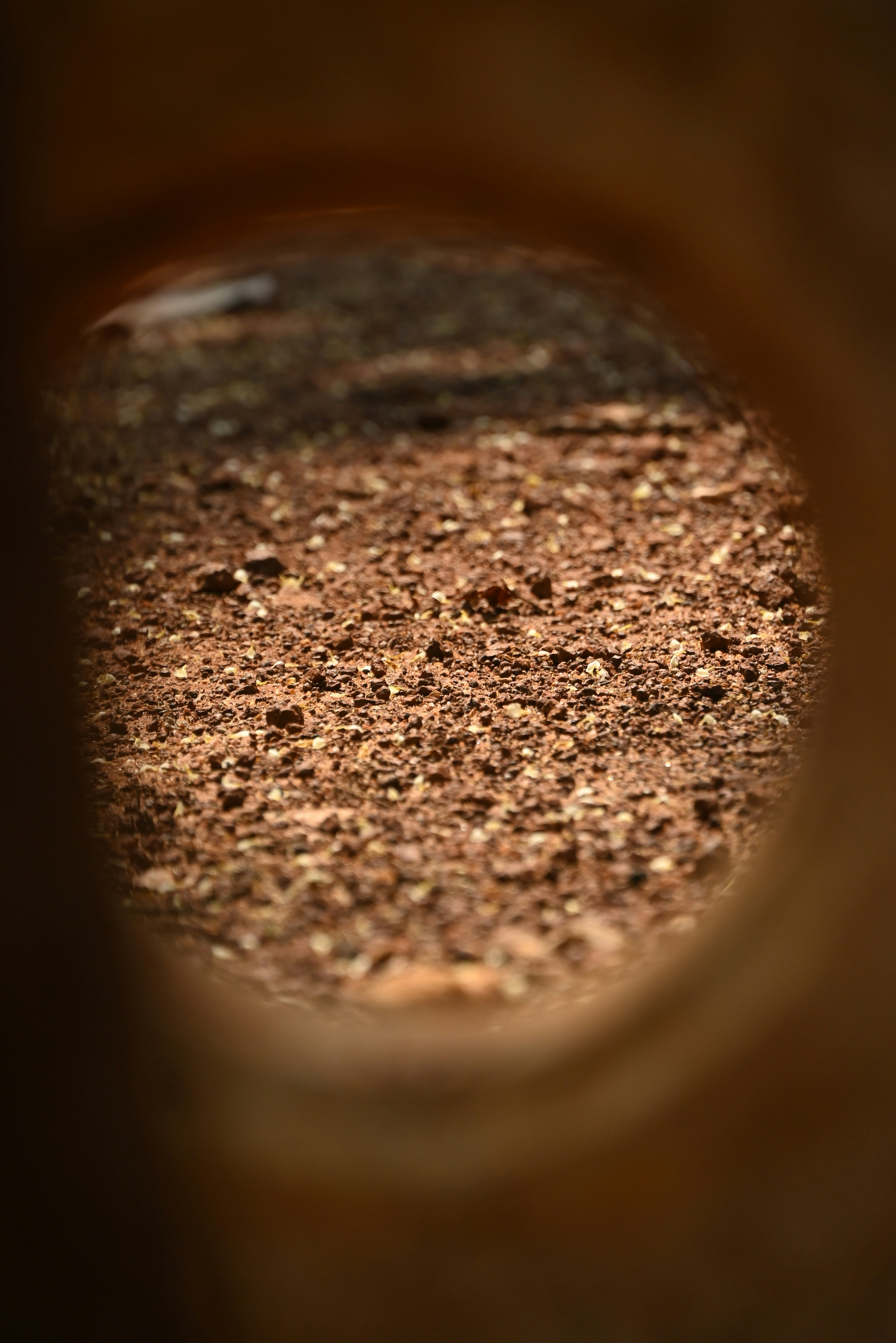 Through a Tiny Aperture: Grain, Ground, and Glow