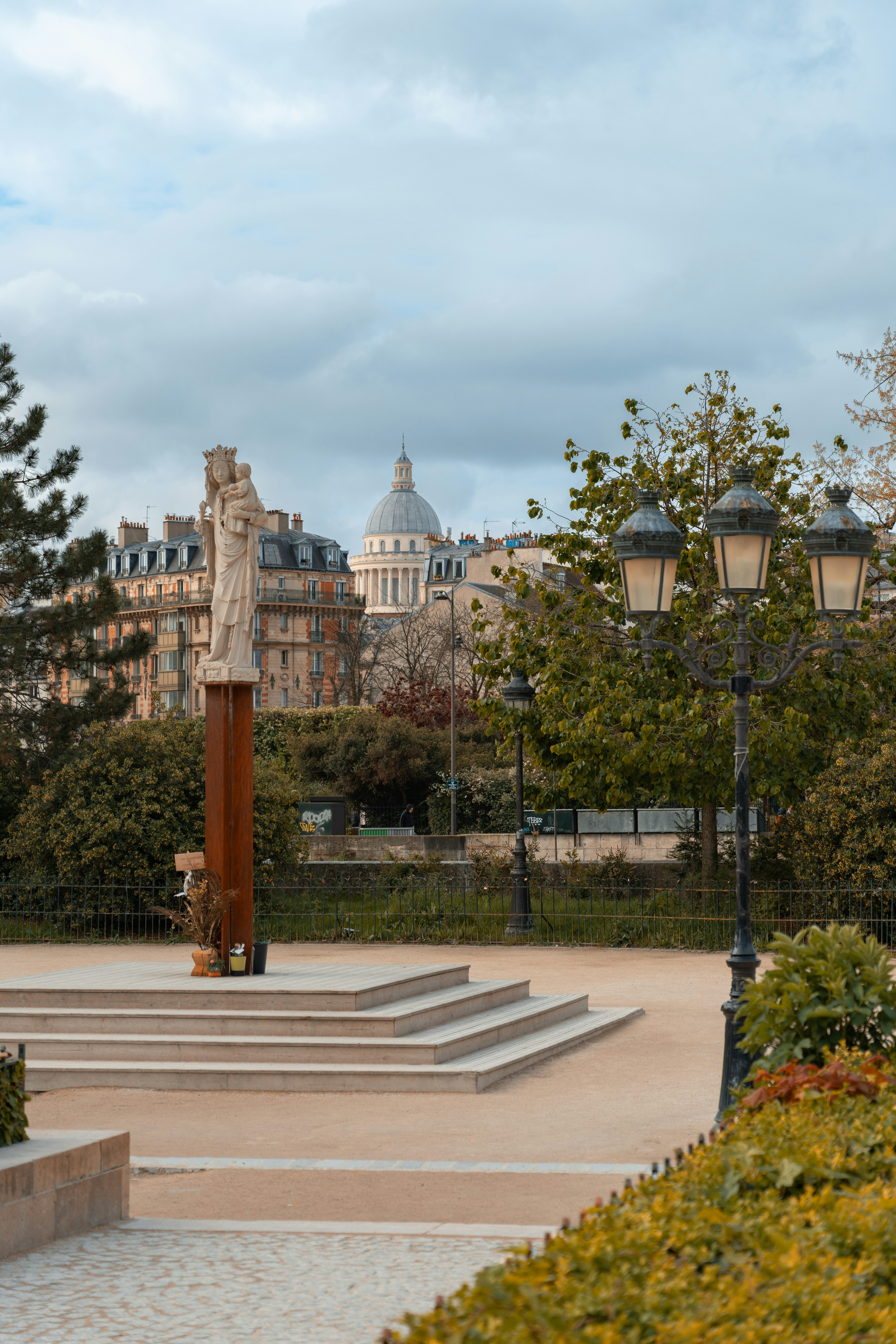 Statue on Steps Overlooked by Historic Domes
