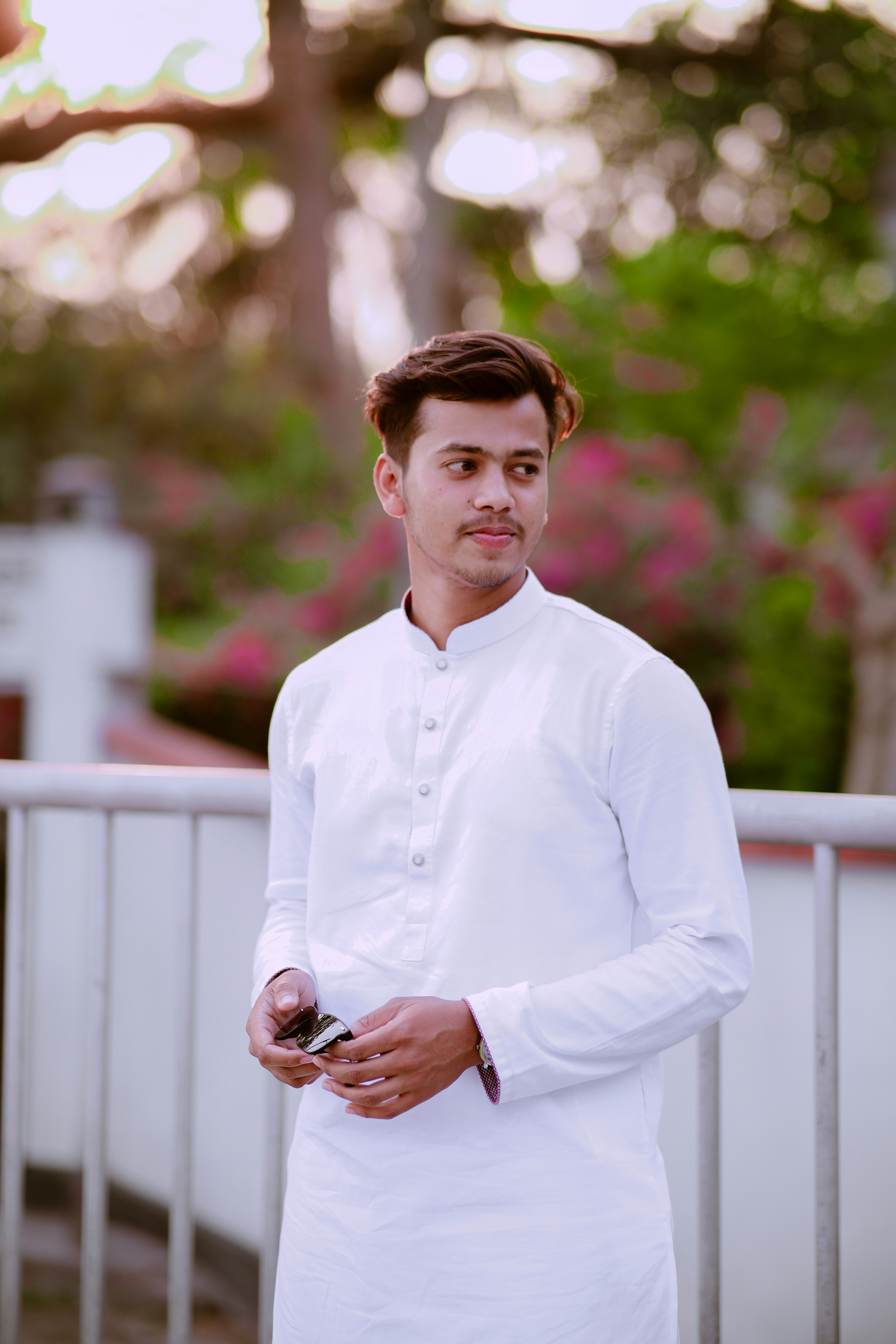 White Kurta, Warm Backdrop: A Quiet Moment in Dusk