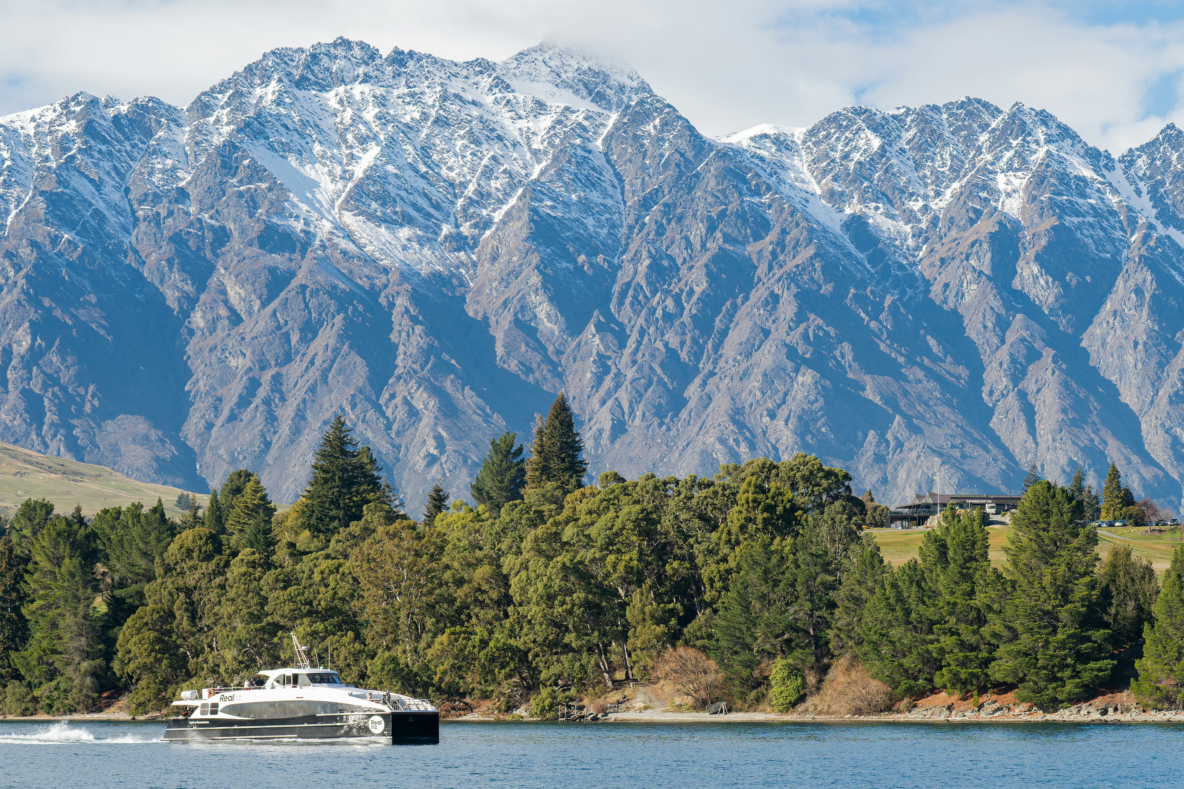 Lakeside Cathedral: Boat at the Foot of Alpine Peaks