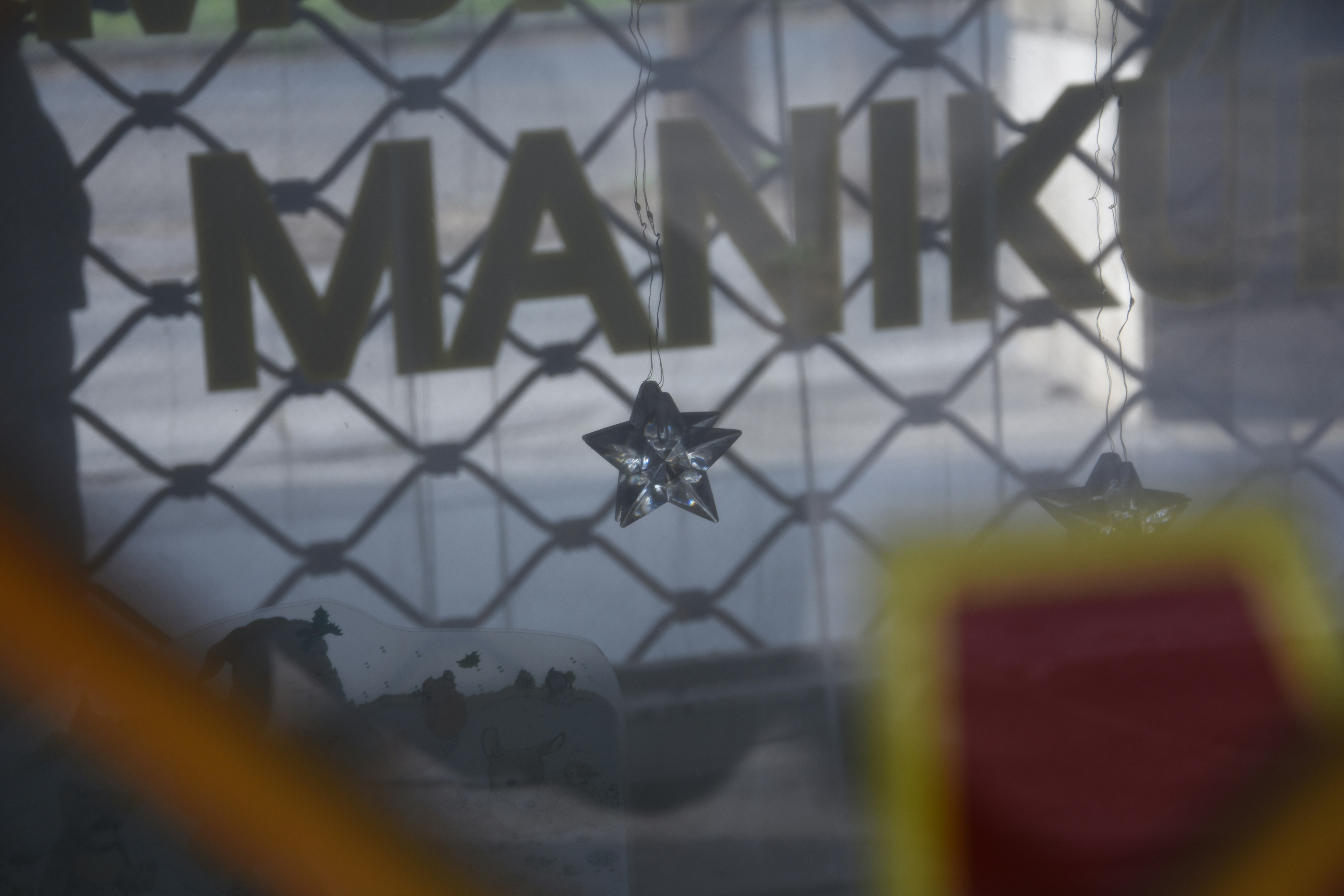 Snow-Cleared Window with Star Emblem and Mesh Pattern