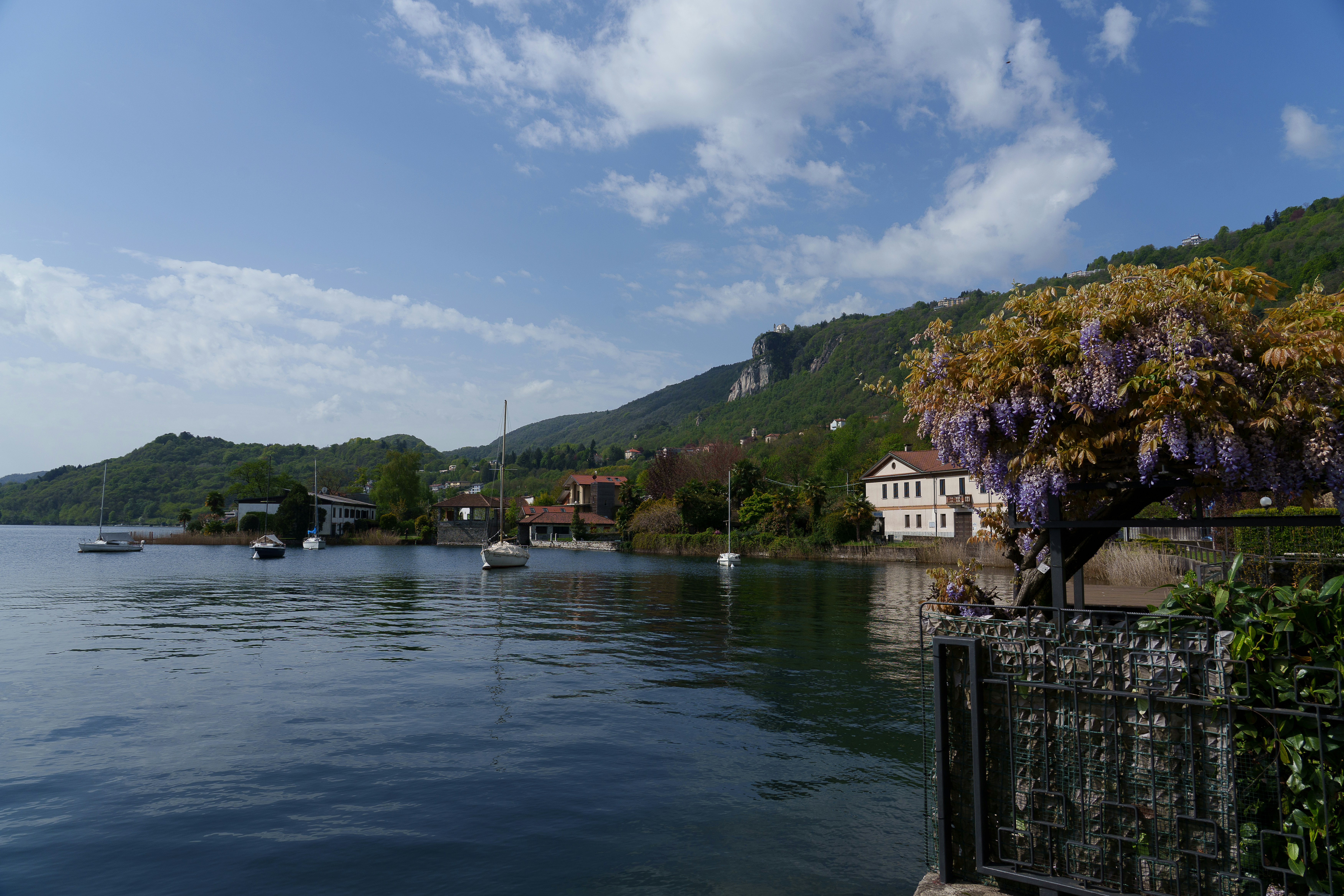 Sunlit Lakeside Village Under a Blue Dusted Sky