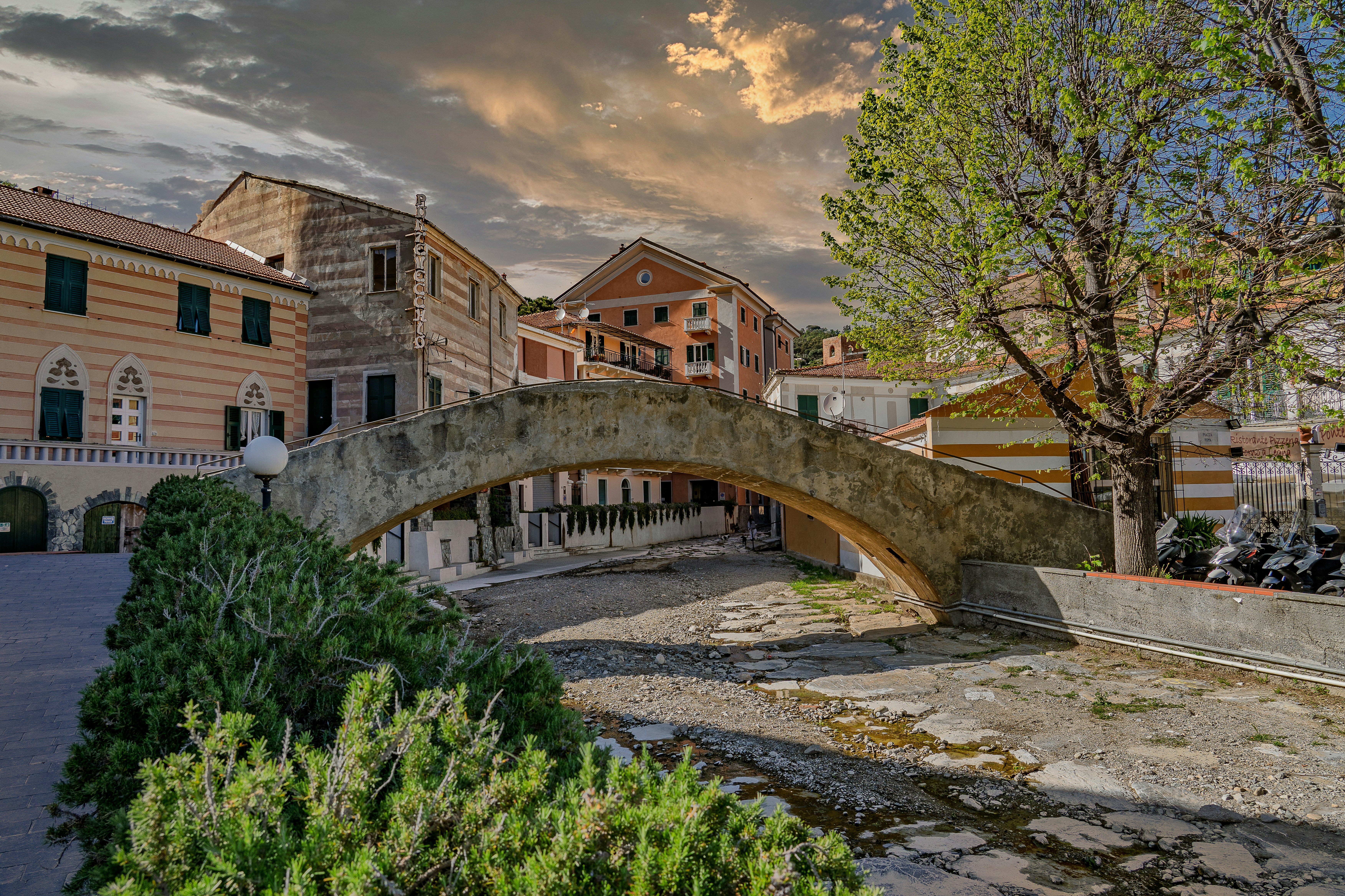 Bridge Over the Sunlit Lane in a Mediterranean Village