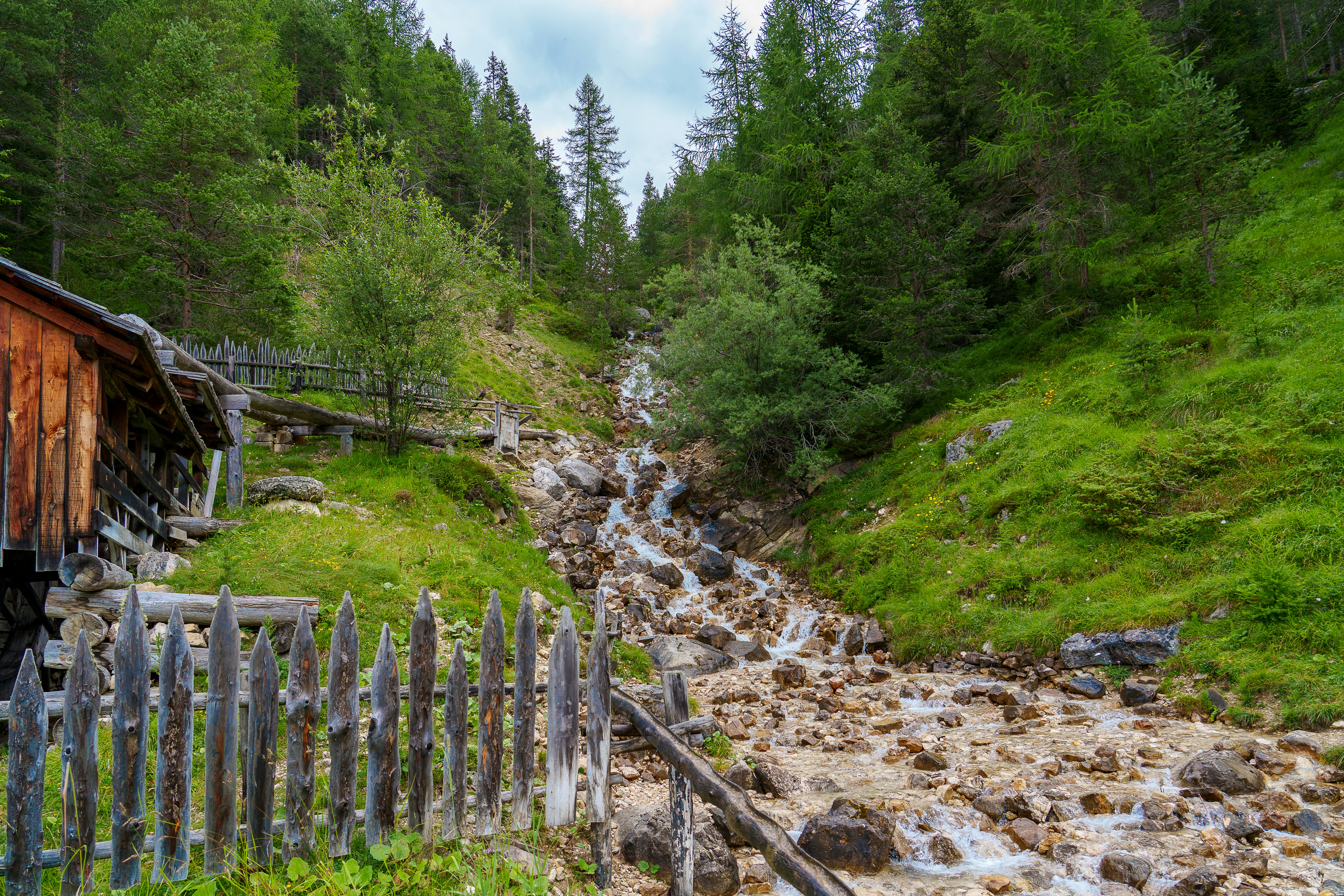 Wooden Fence Gate Overlooking a Mountain Creek