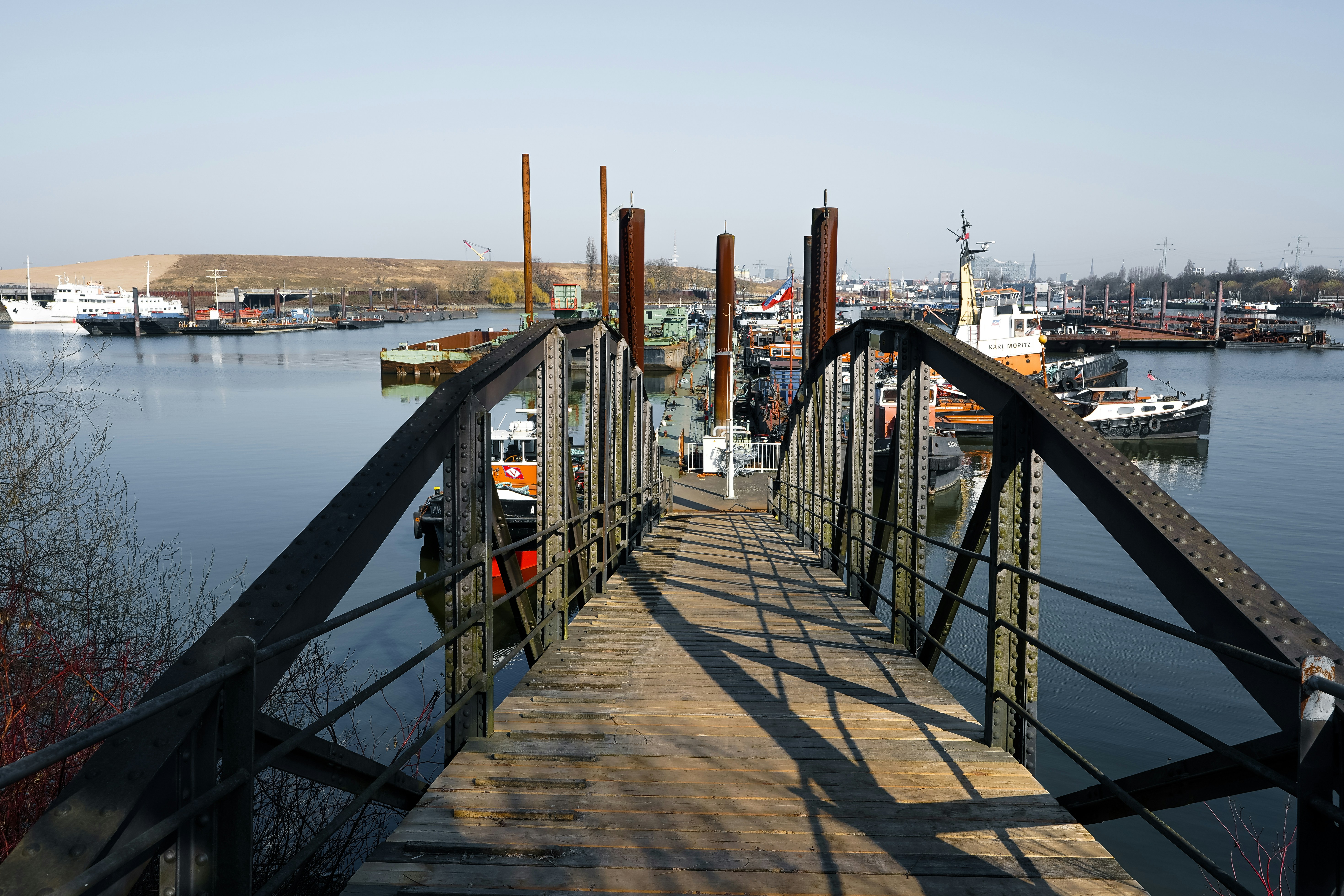 Iron Arches over Quiet Waters: A Dockside Walkway to the Docks