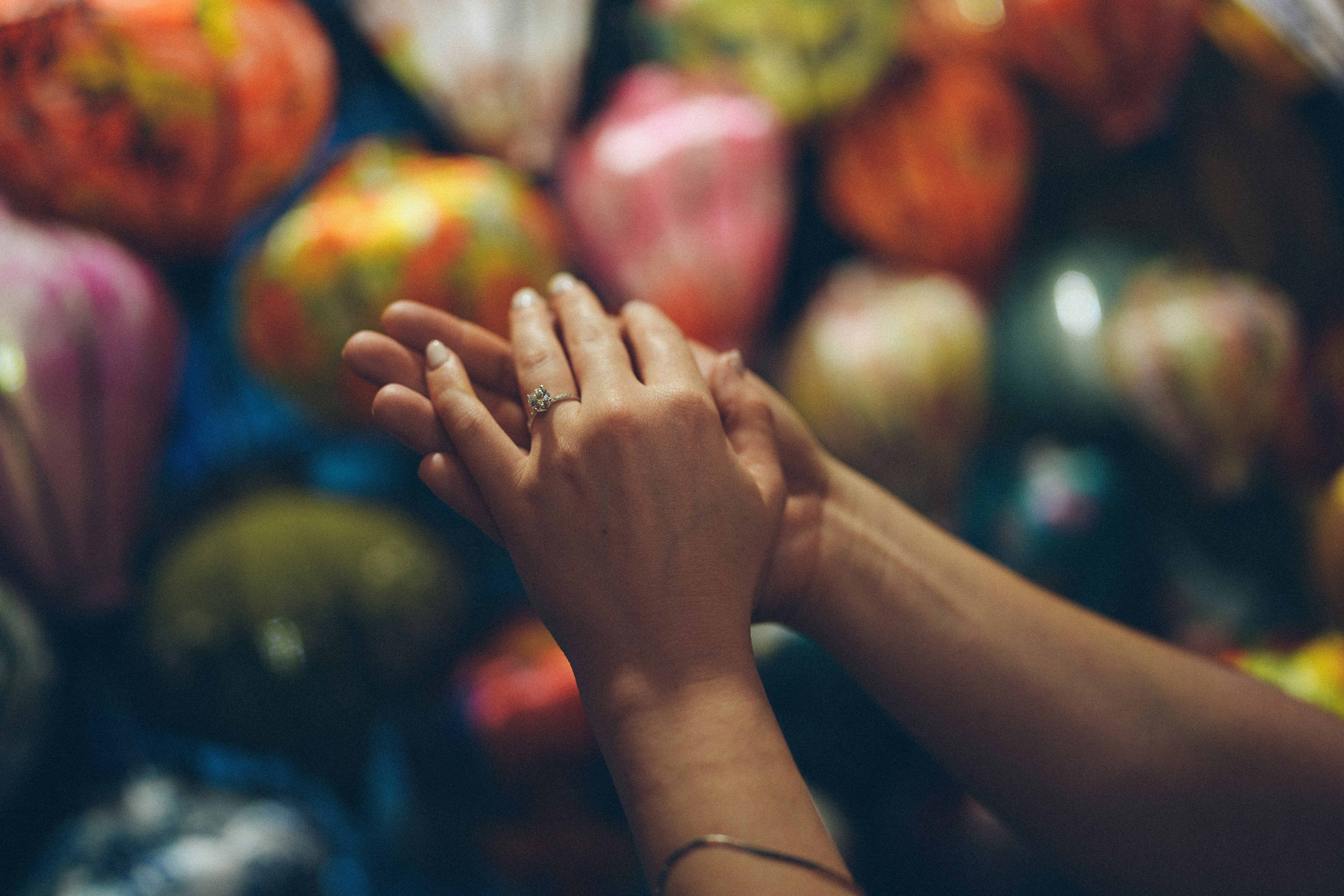 Hands in Harmony: A Moment of Connection Above a Palette of Candy