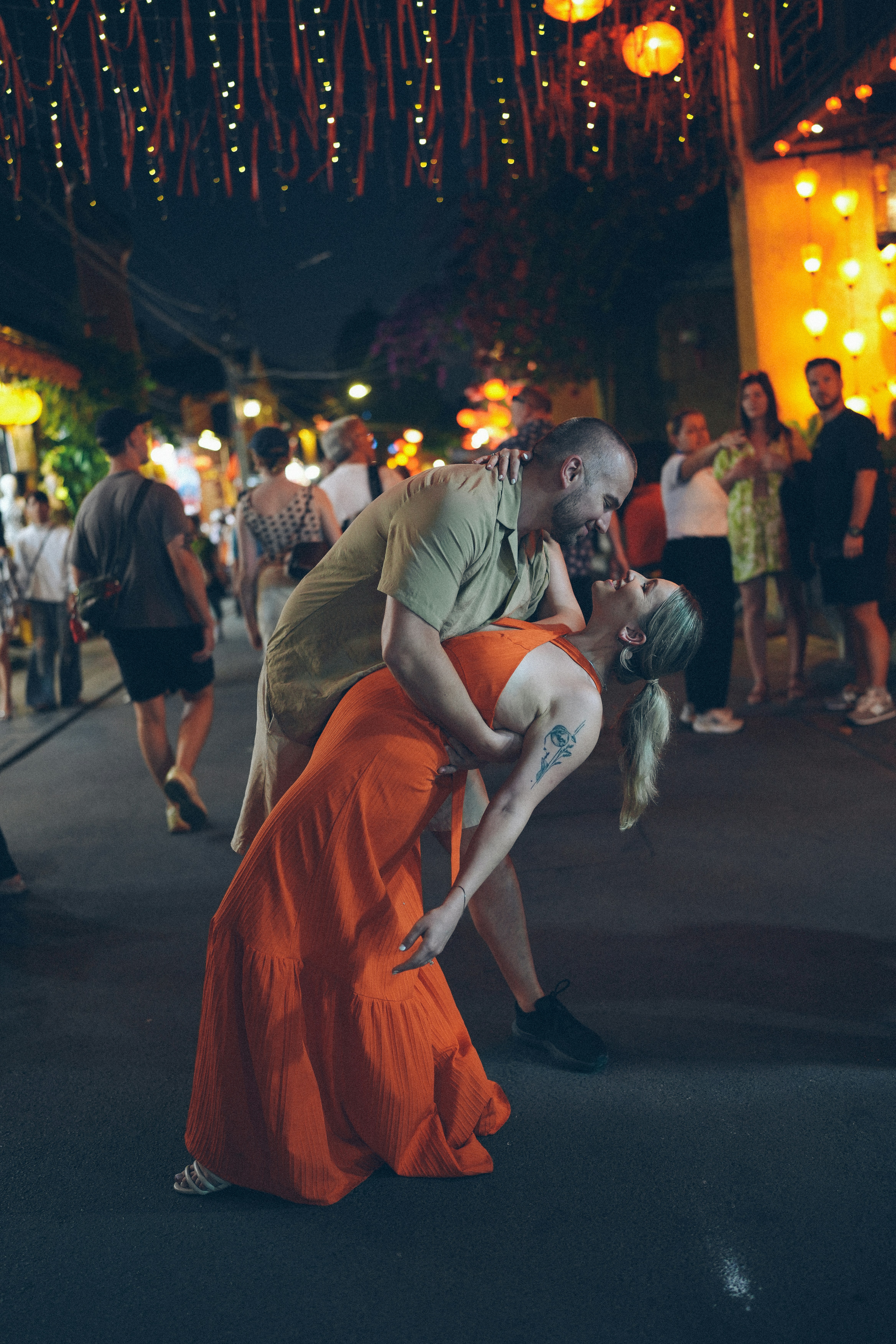 Dancing Affection Under Festive Lights