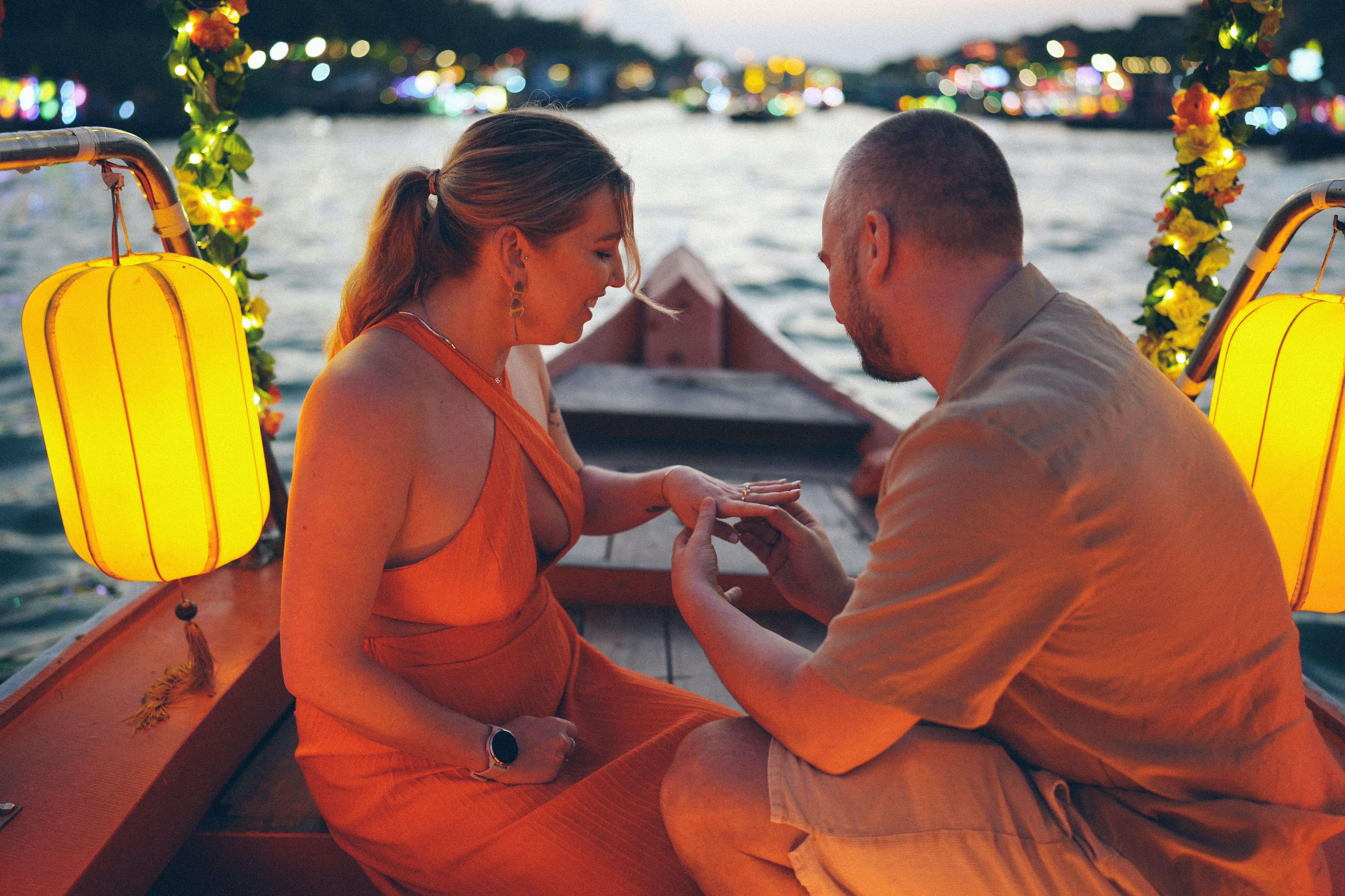 Lights, rings, and a quiet exchange on a moonlit boat