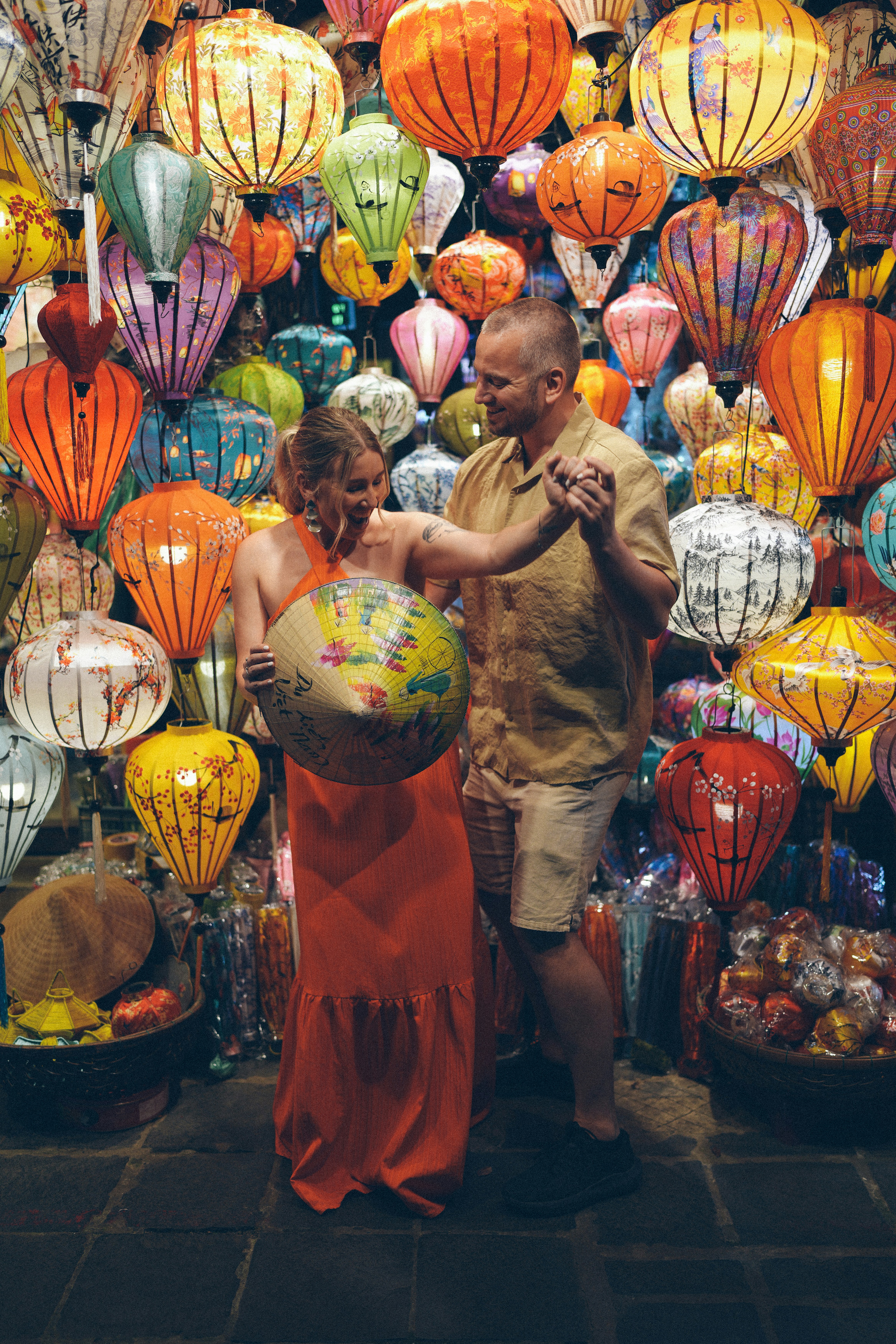 Twirl of Lanterns: A Dancing Moment Amid Floating Orbs