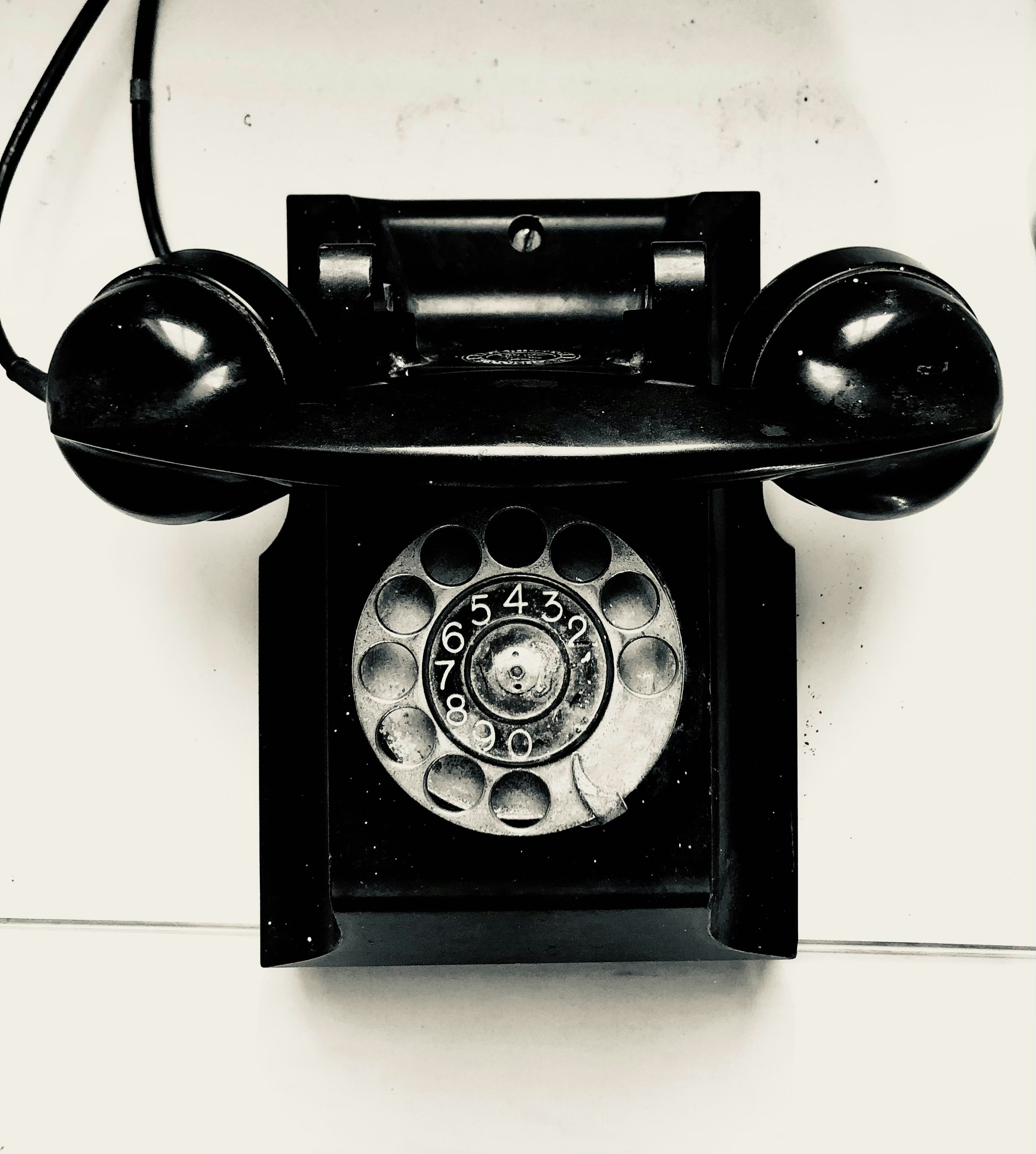Old Rotary Dial Telephone Centered in a Monochrome Still Life