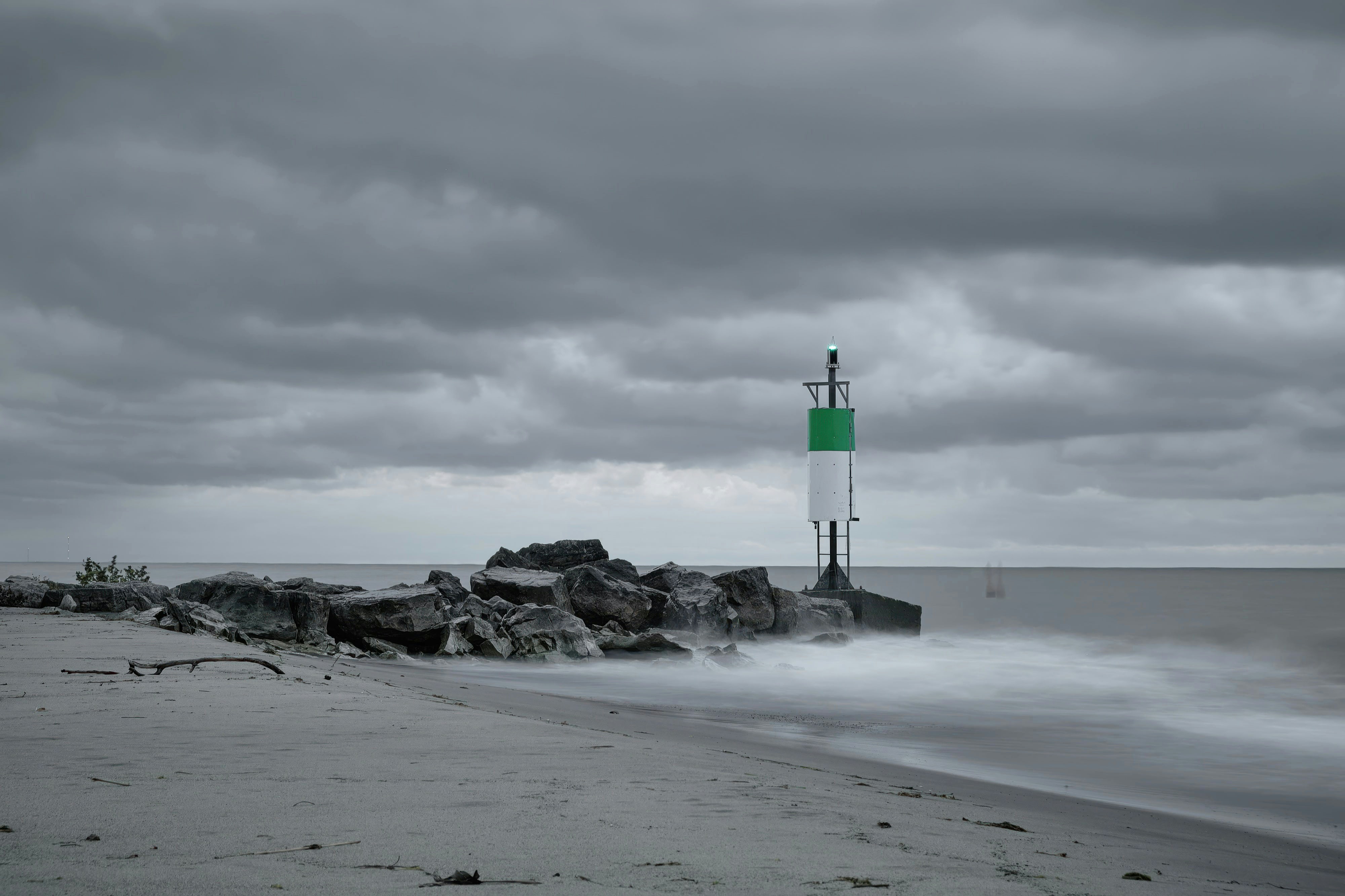 Lighthouse on Calm Horizon: A Lone Beacon Amid Quiet Seas