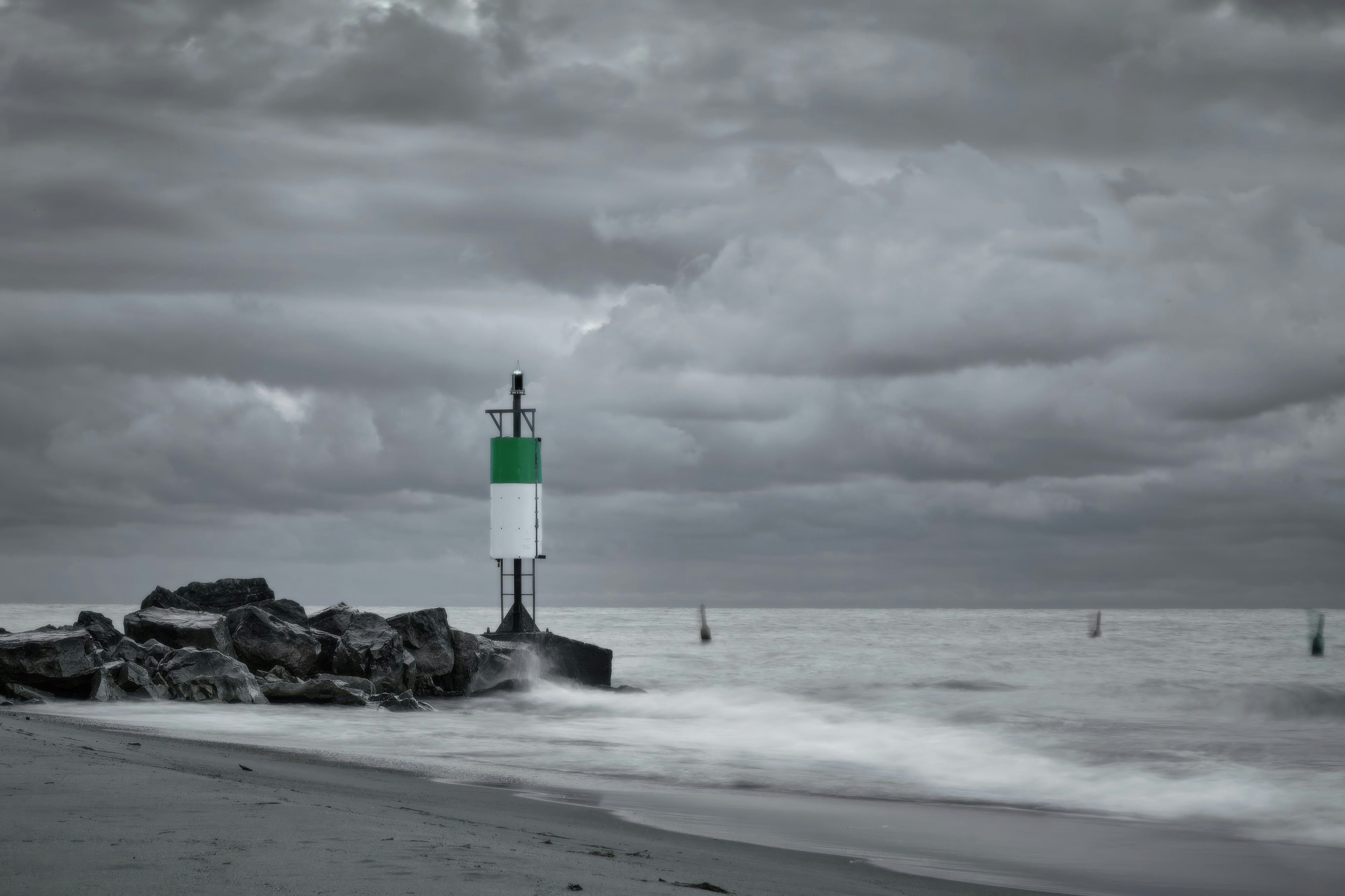 Coast Guard Beacon at Dusk: A Quiet Sentinel Over Churning Waters