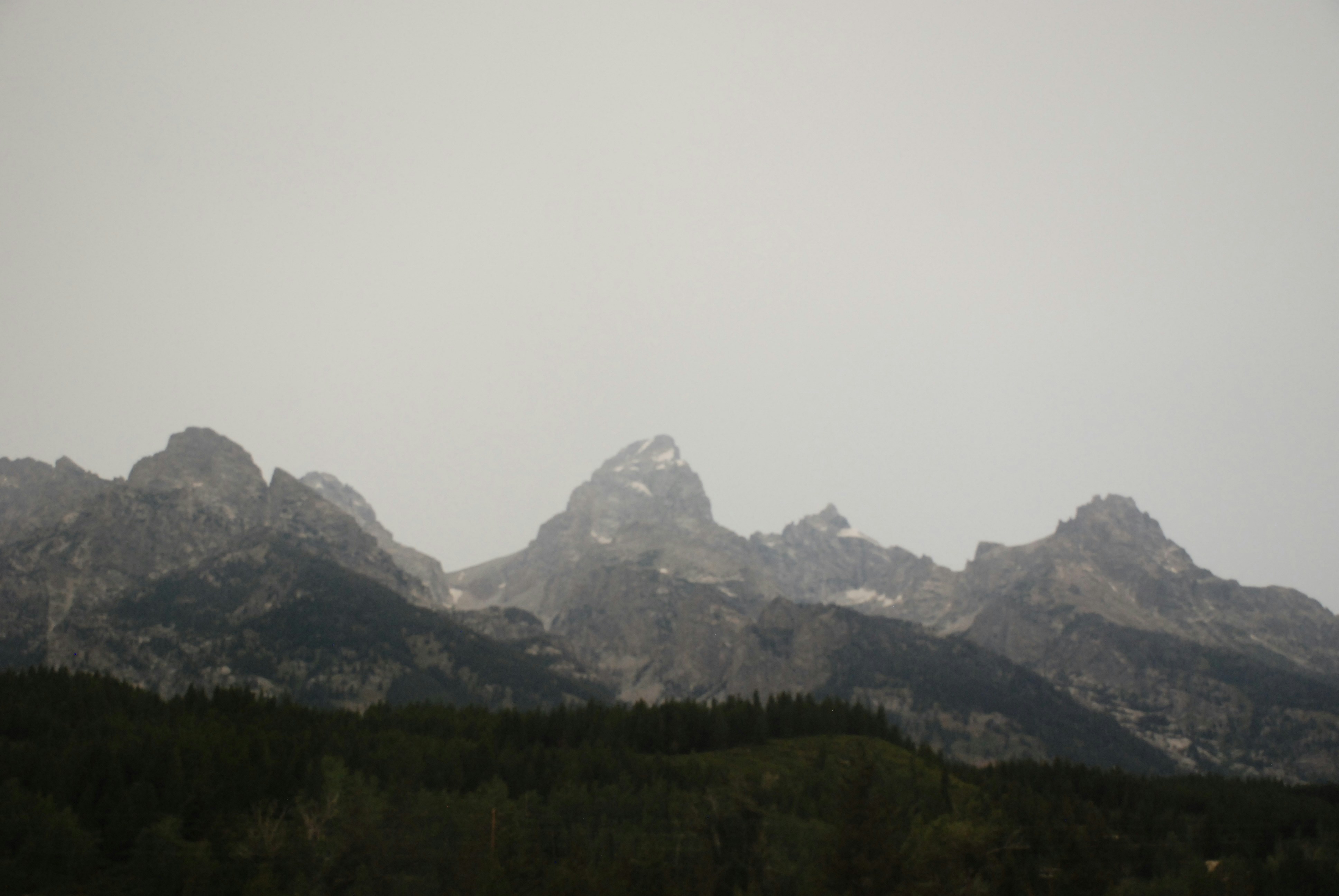 Moonlit Ridge: Quiet Peaks Under Overcast Sky
