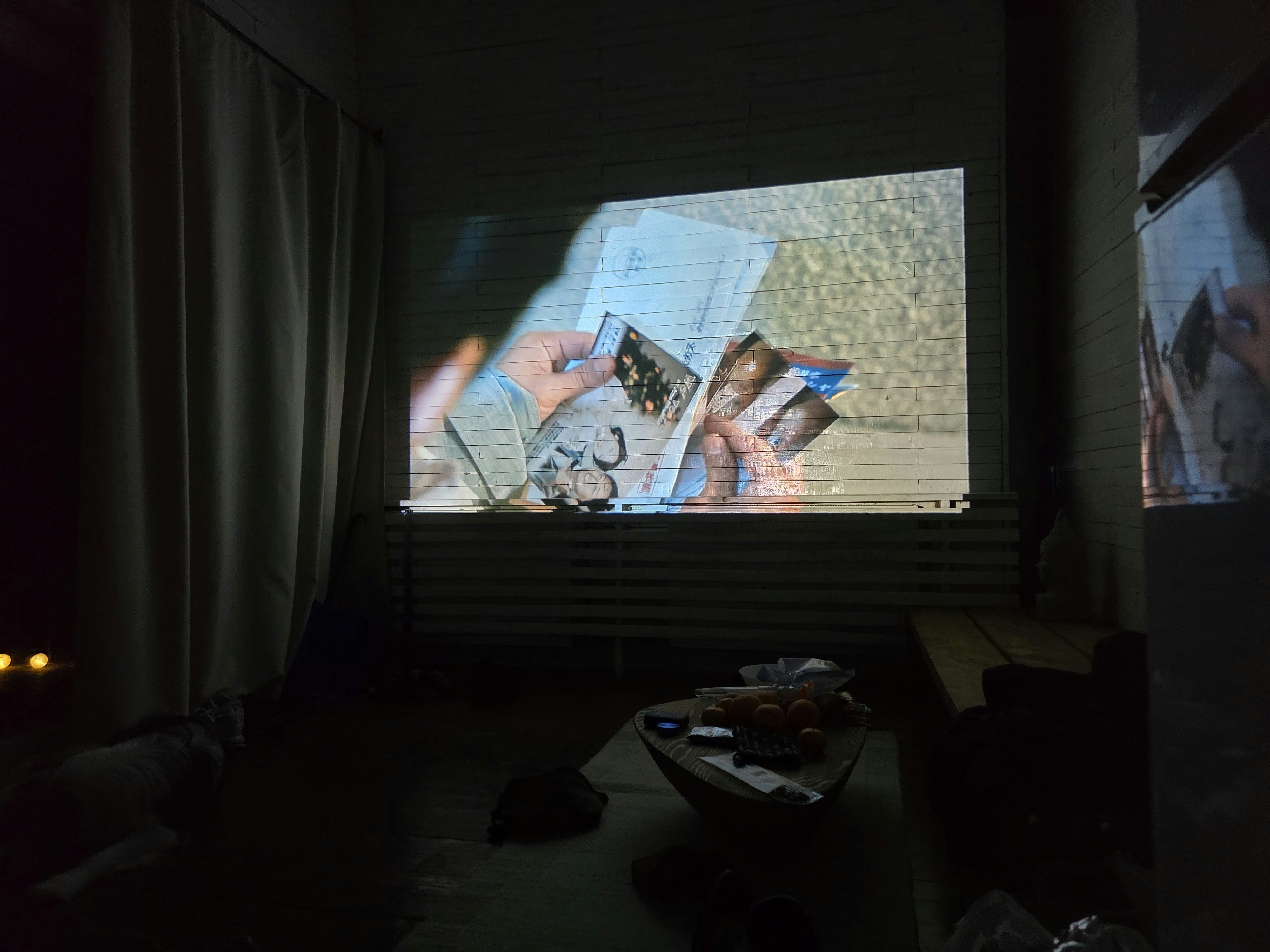 Projected Quiet: A Dim Lounge with a Handful of Paper and Snacks
