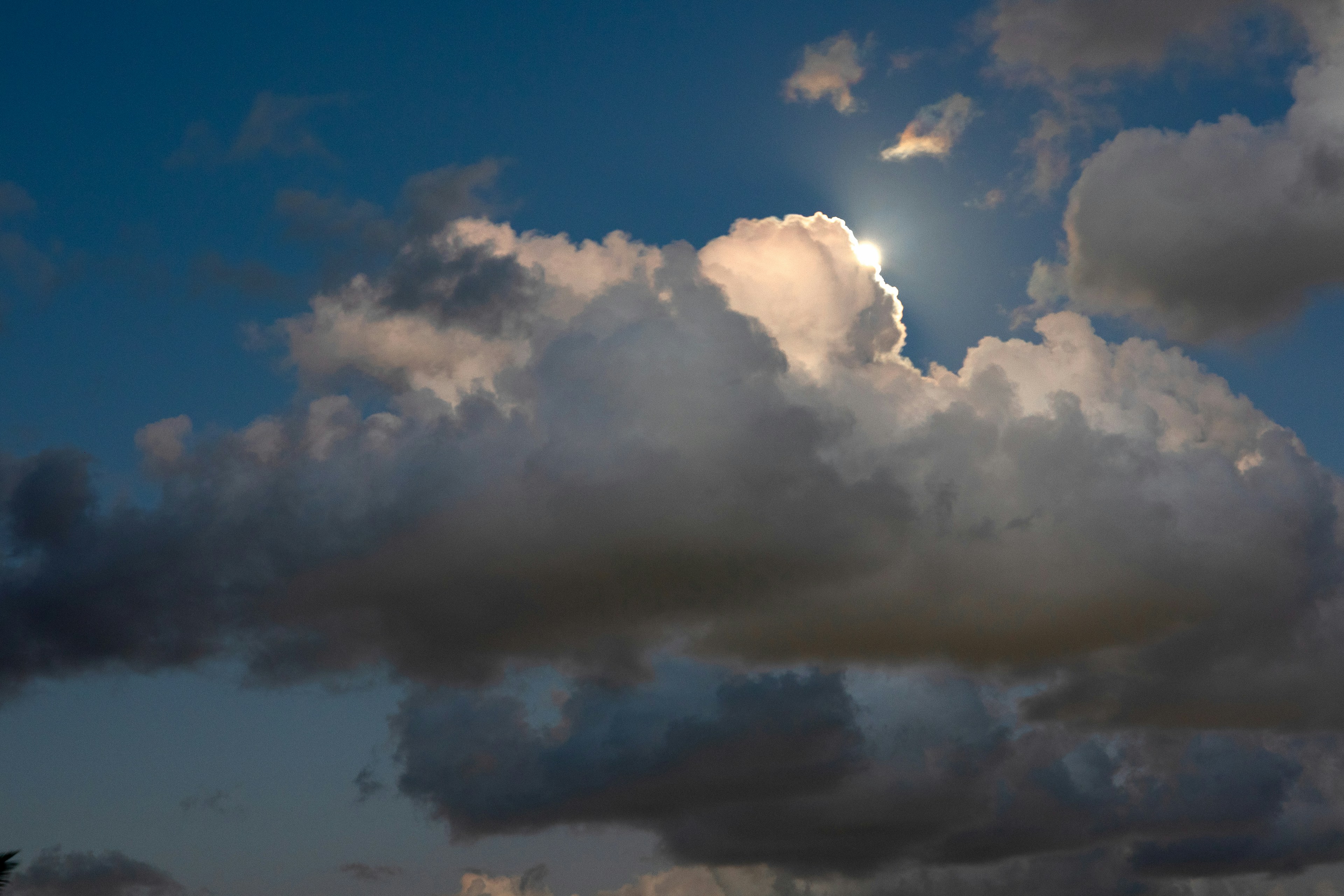 Sunlit Crown: A Break in the Clouds Over a Quiet Sky