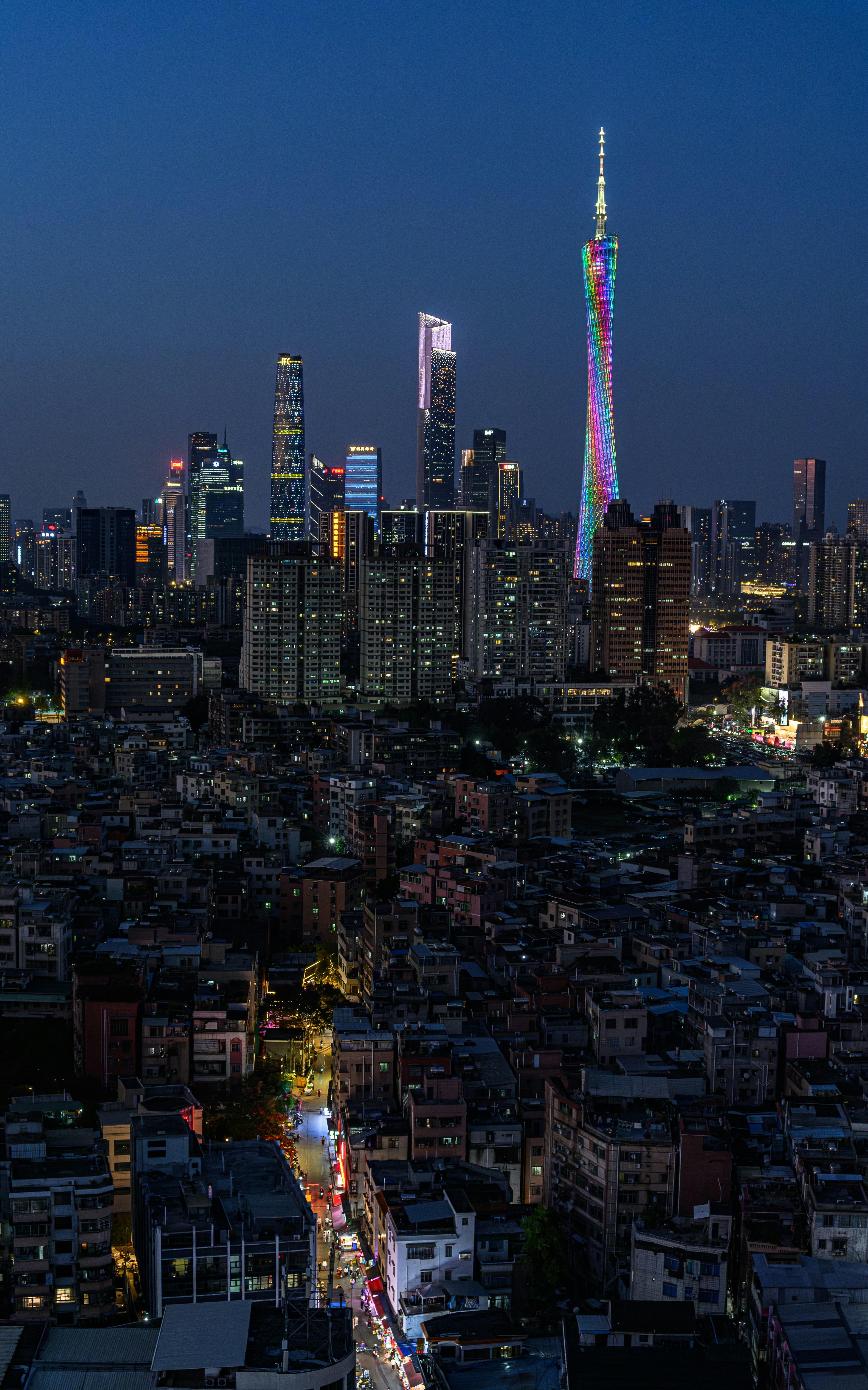 Neon Spire over a Sea of Midnight Blocks